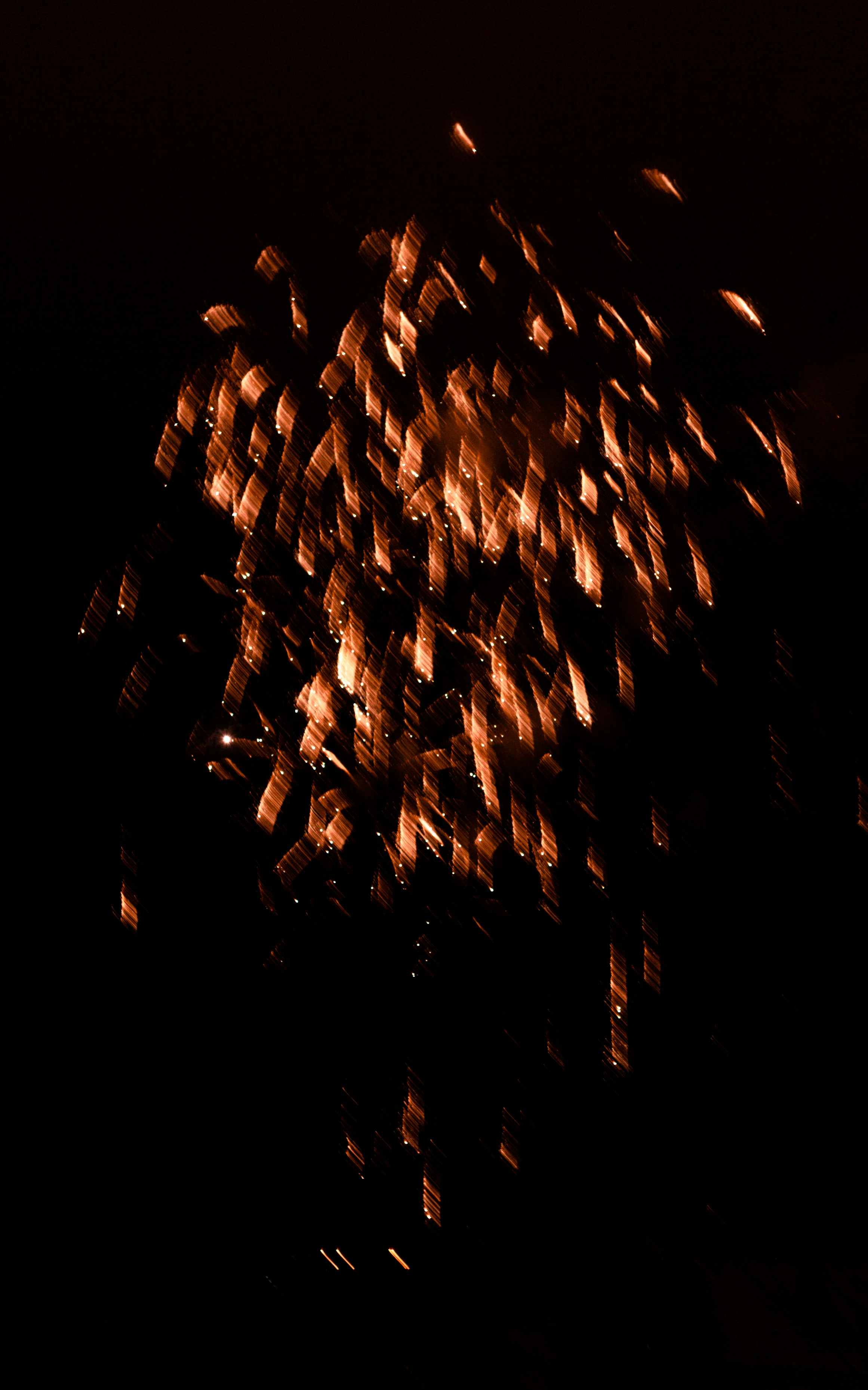 a large amount of fire is lit up in the dark