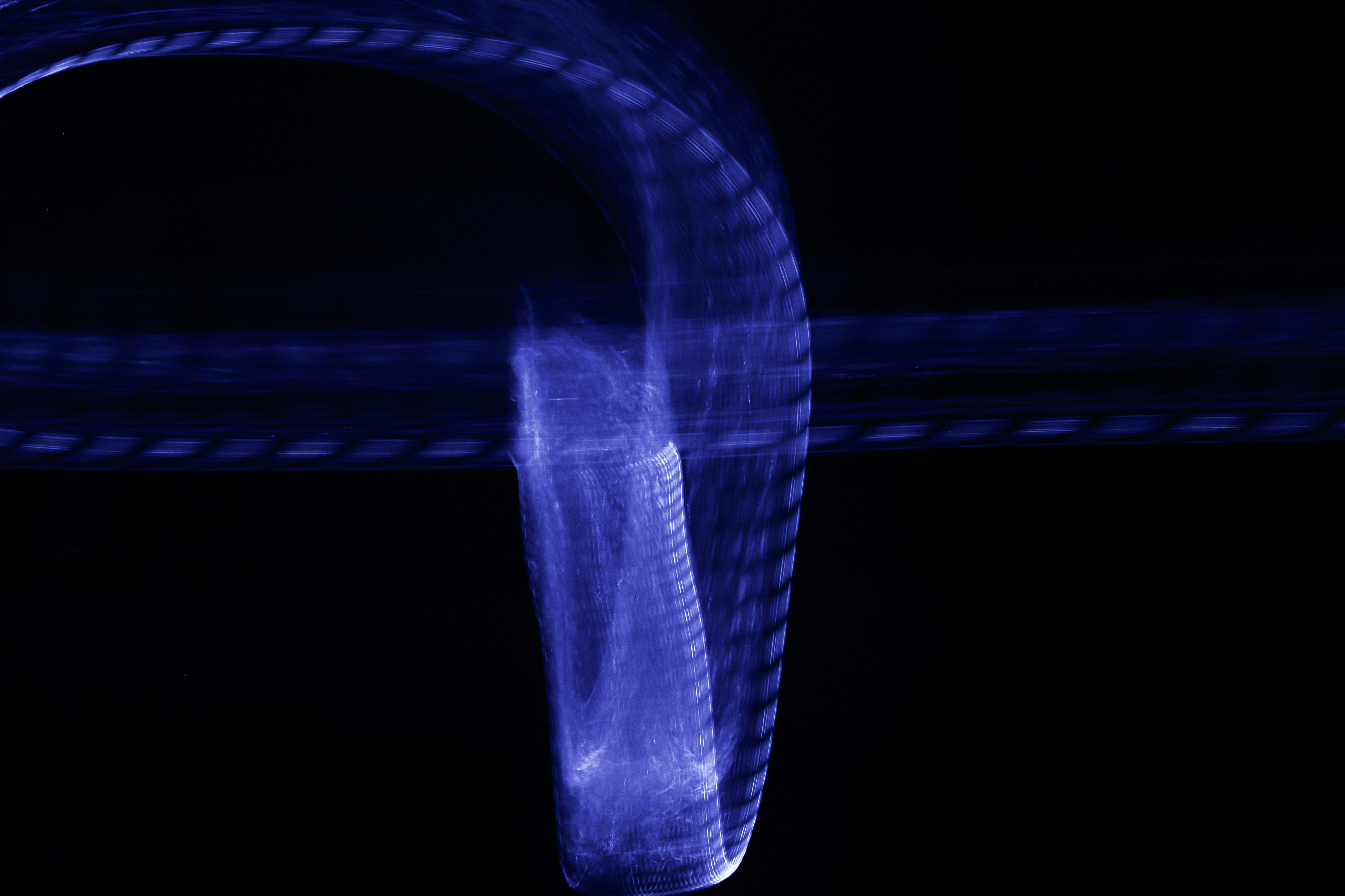 A close up of a blue object in the dark photo – Free Abstract Image on ...