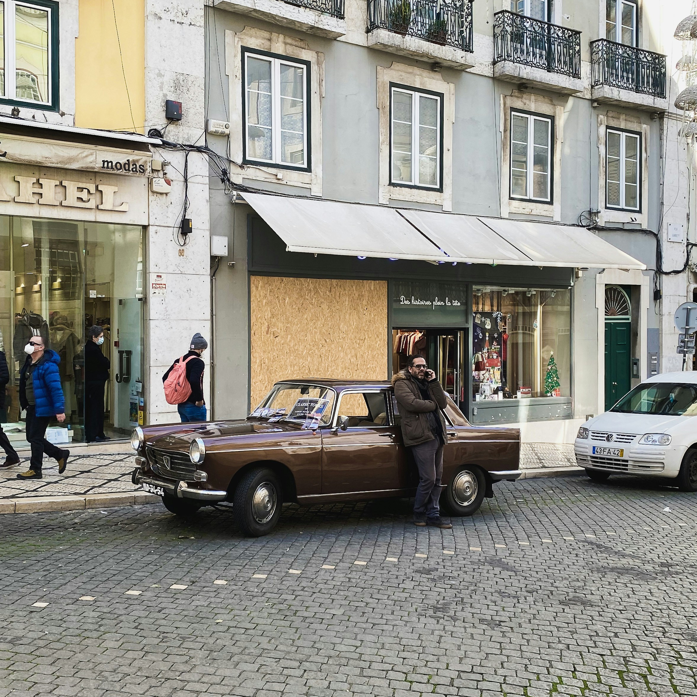 Cobbled Street Pause: A Brown Classic by Pastel Facades