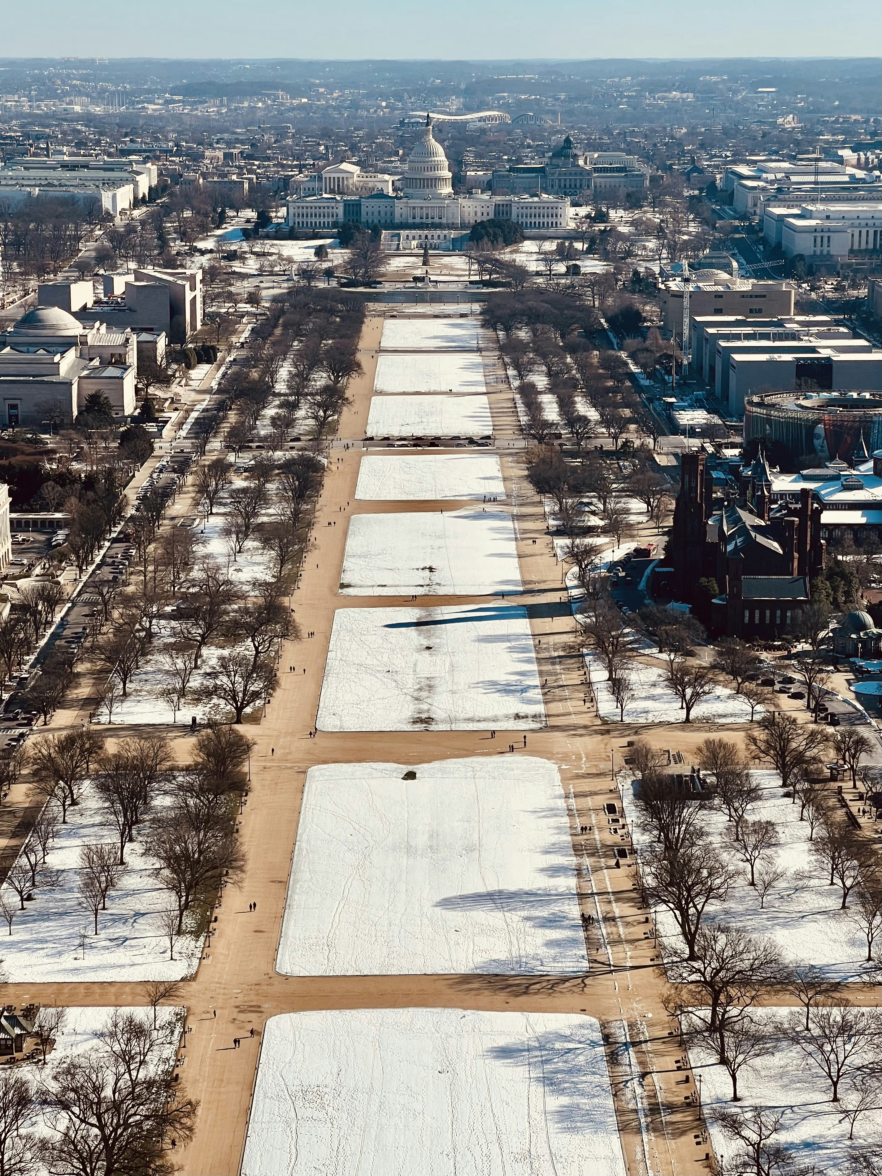 An aerial view of a city with a lot of snow on the ground photo – Free ...