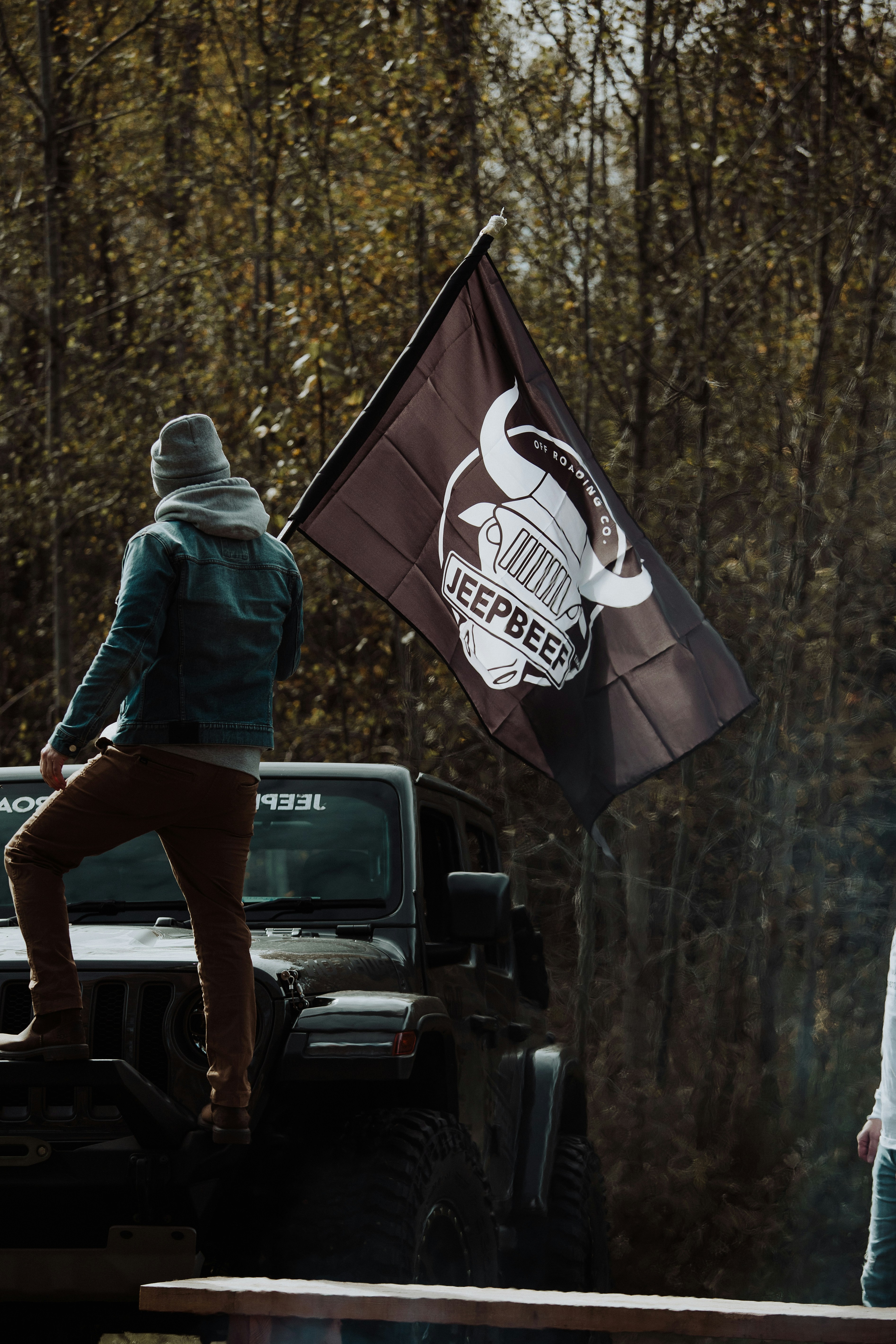 Flag of the Off-Road Rally: Bold Banner Flies over a Jeep