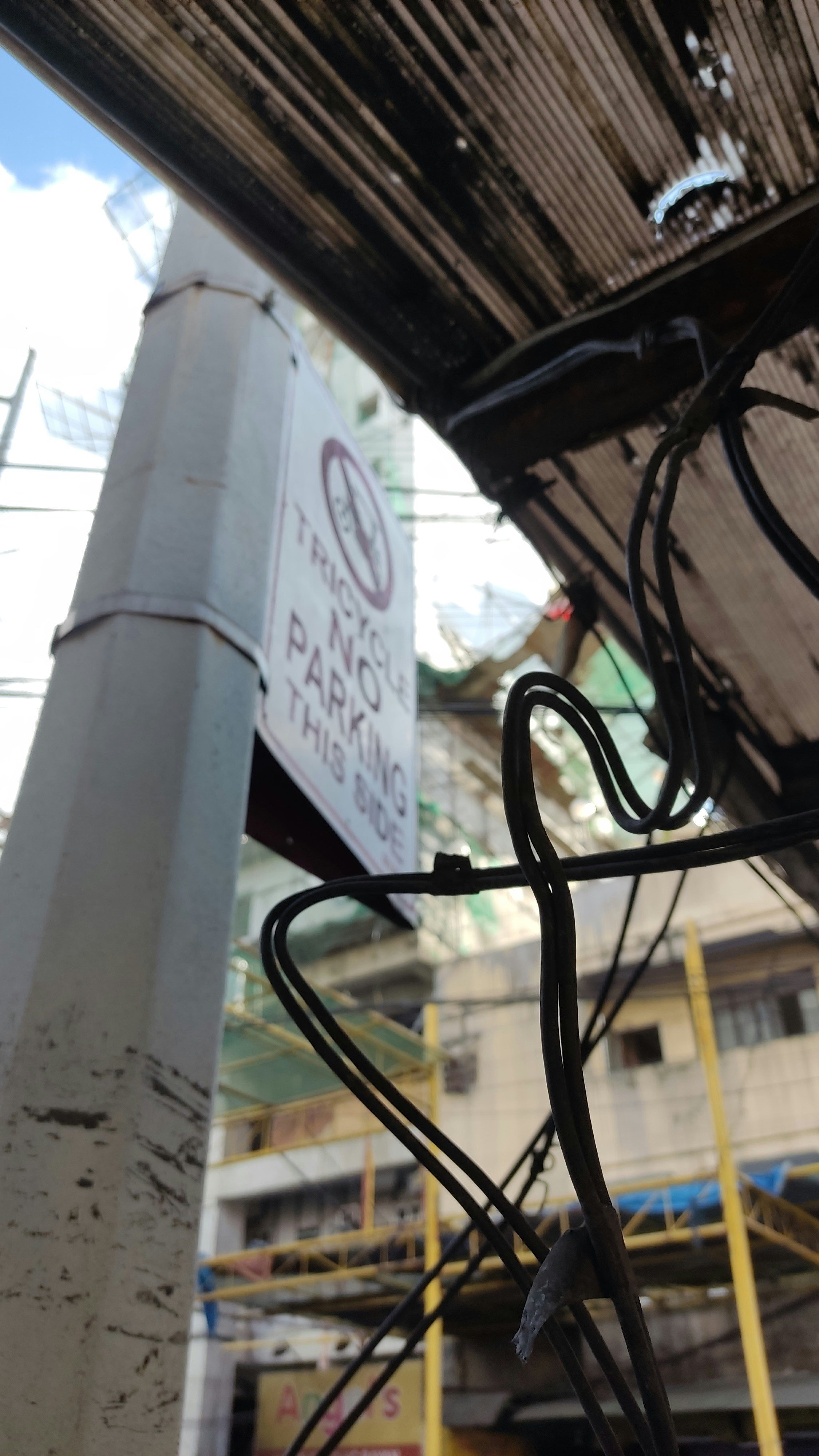 A close up of a pole with a sign on it photo – Free Street Image on ...