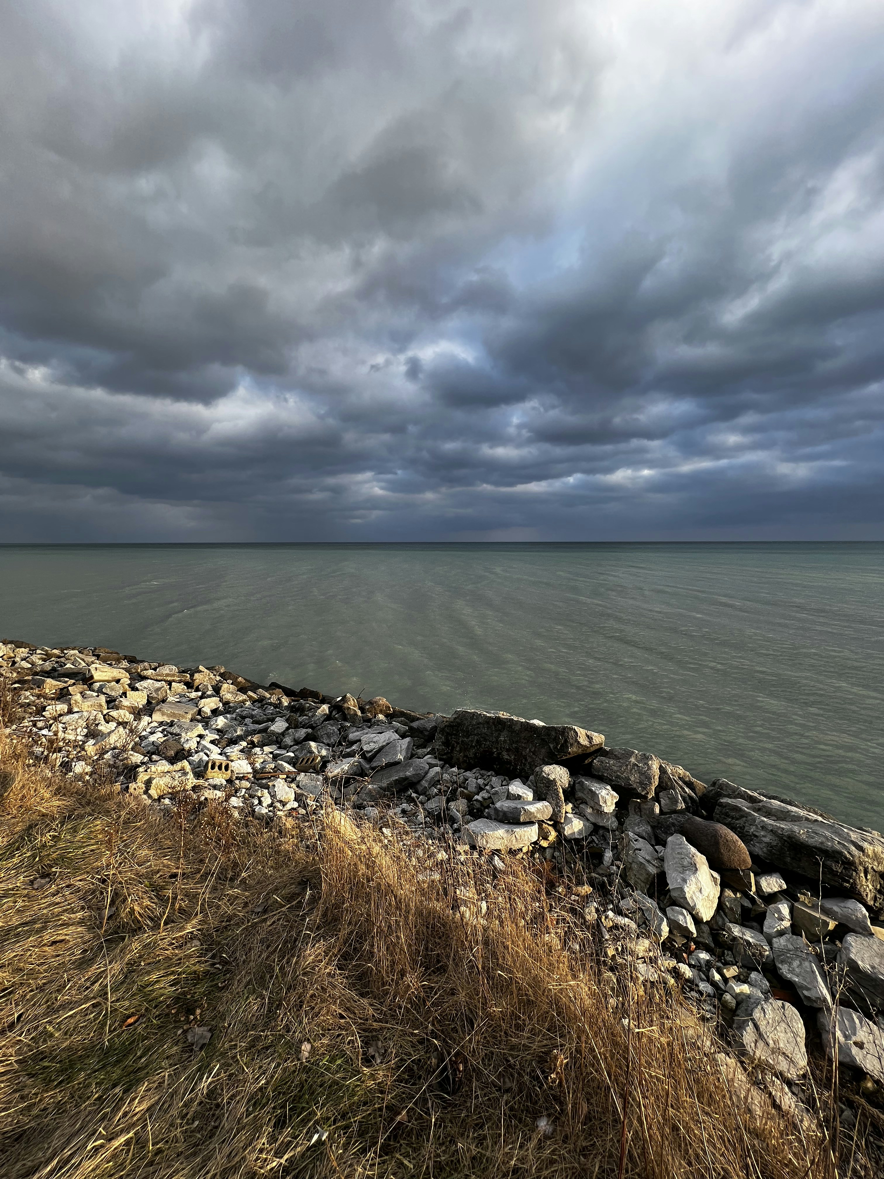 A view of the ocean from a rocky cliff photo – Free Rubble Image on ...