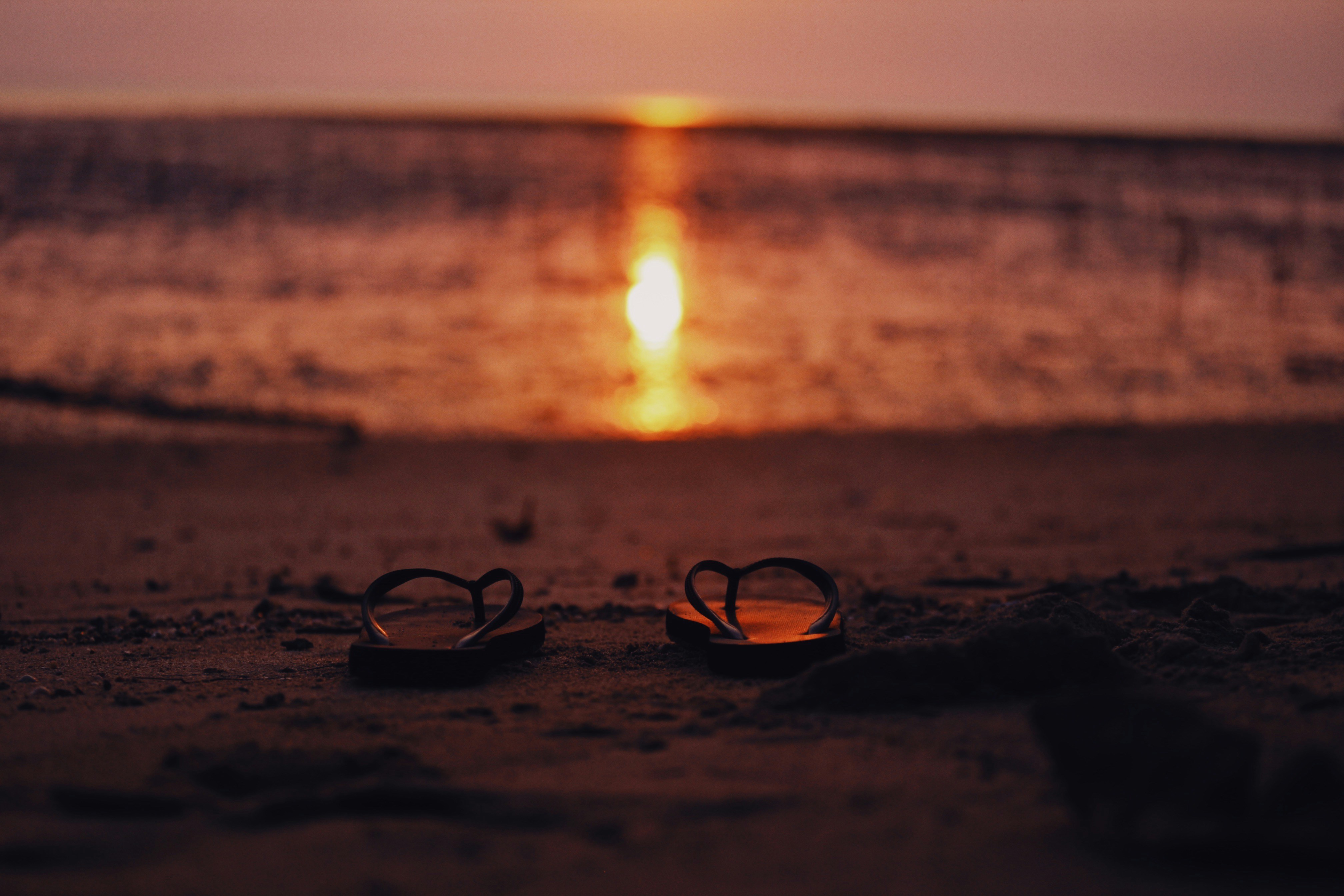 Sunset Sand: Two Glasses at Dusk