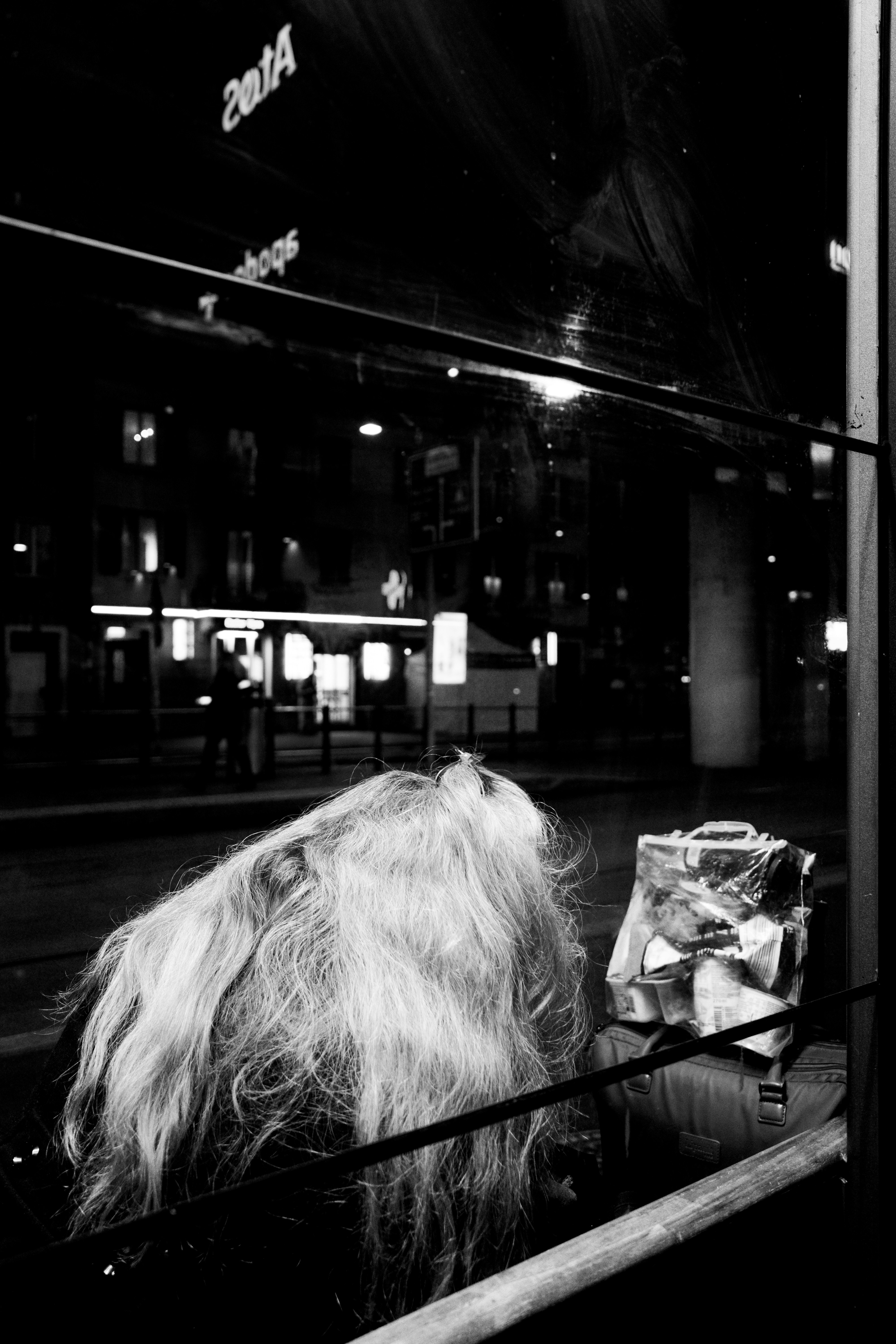 Midnight Window Portrait: Back of a Long-Haired Figure by Neon Reflections