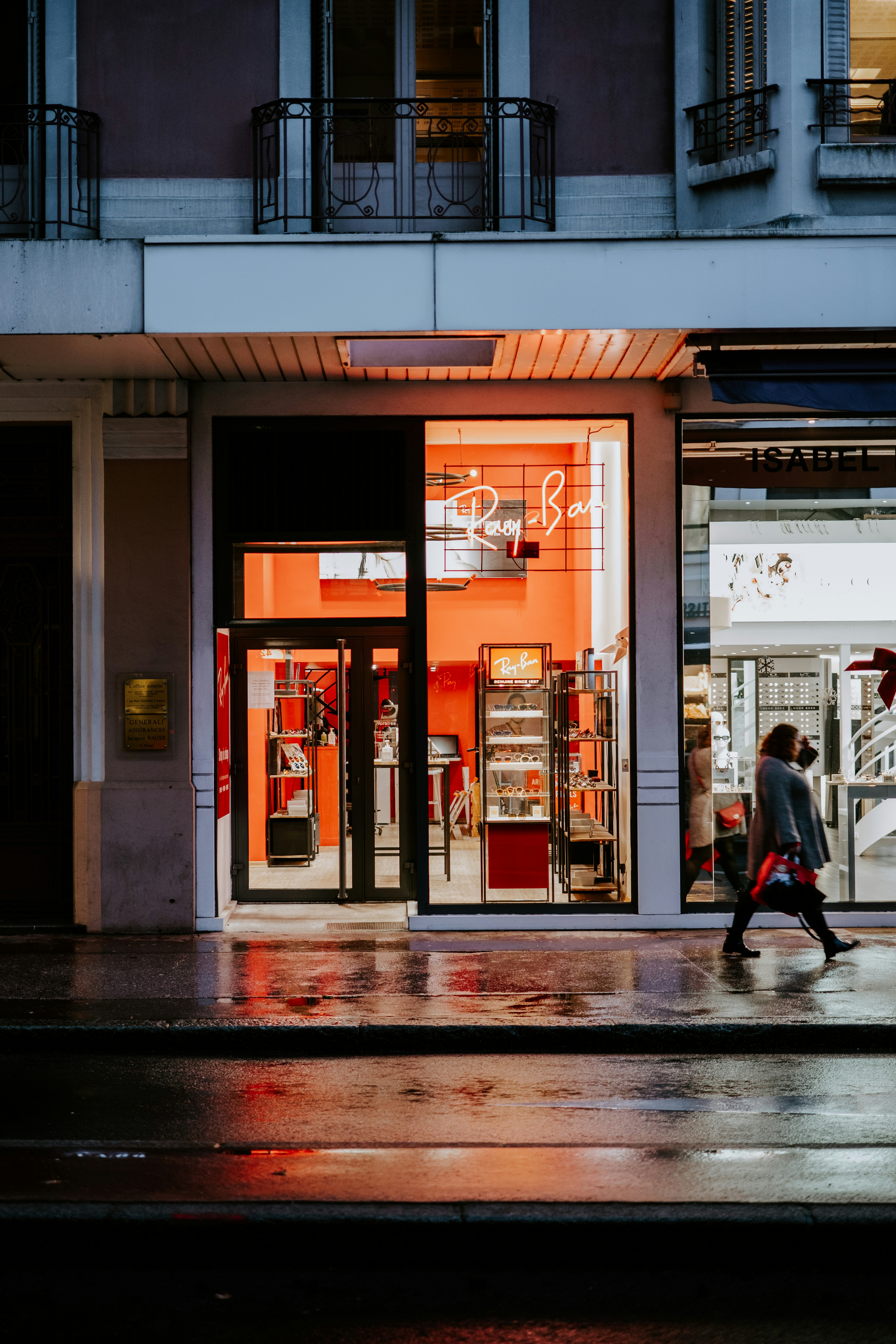 a person walking down a street with an umbrella