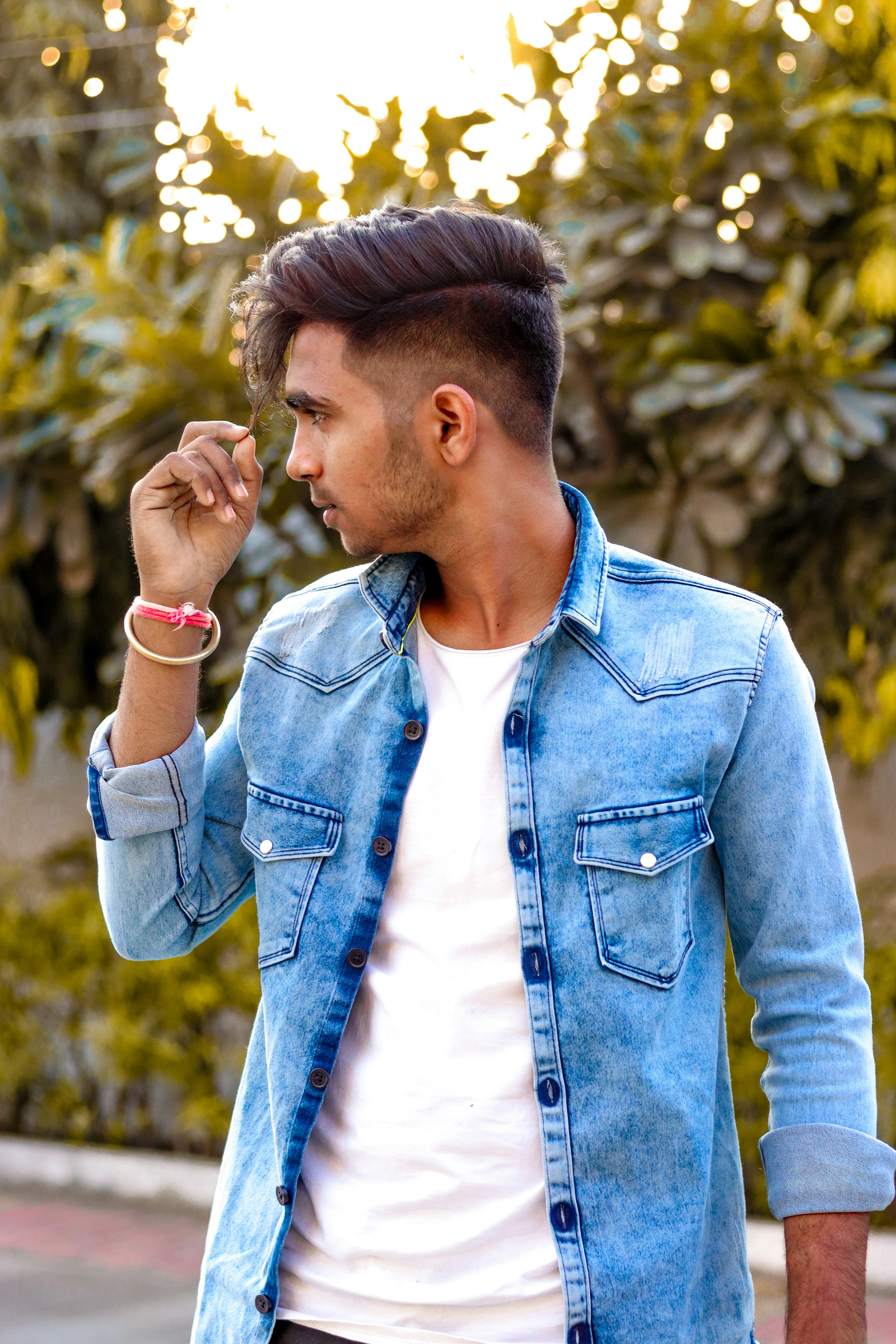 A man in a blue jean jacket smoking a cigarette photo – Free Aurangabad ...
