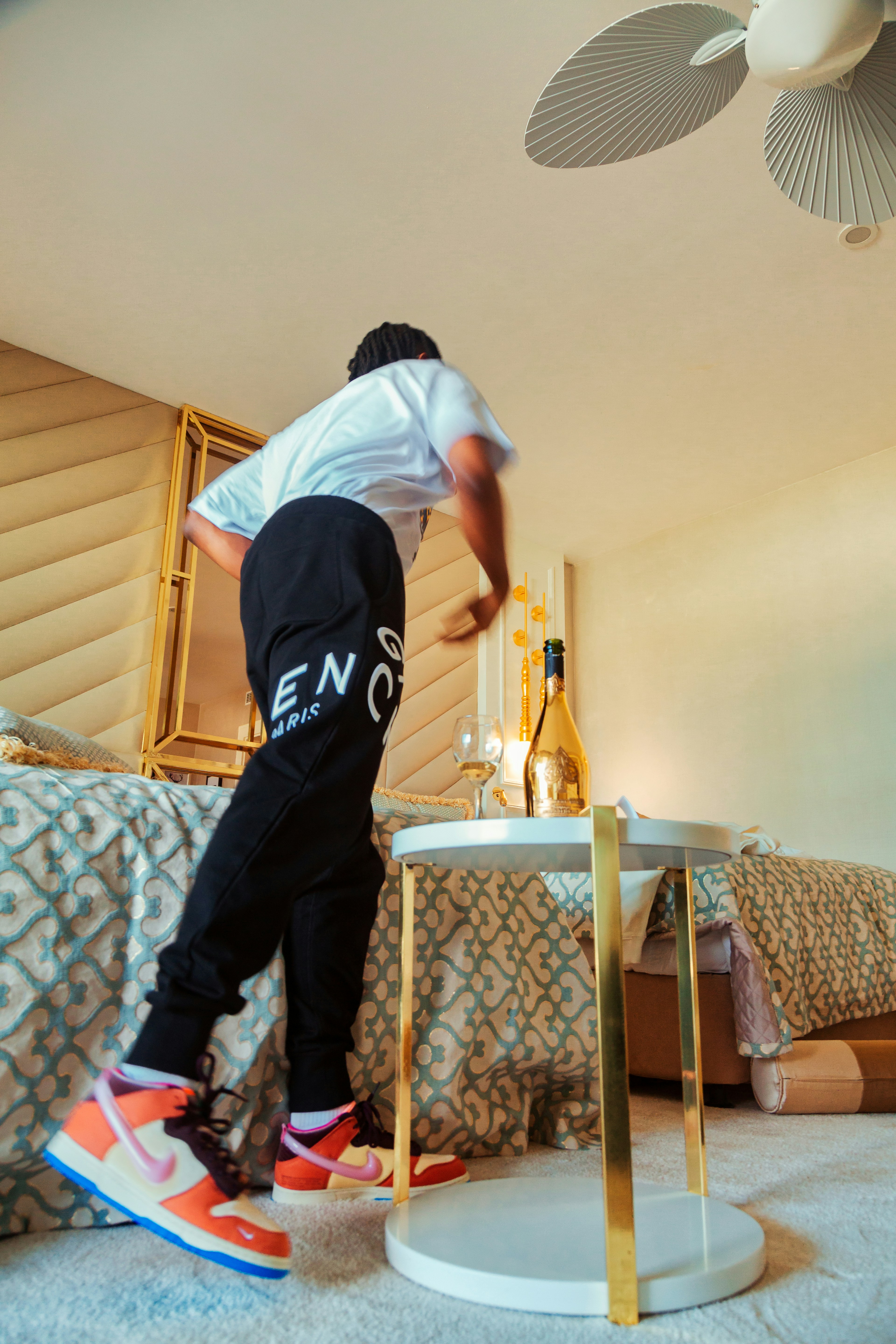 Midstride in a Quiet Bedroom: A Burst of Color and Motion