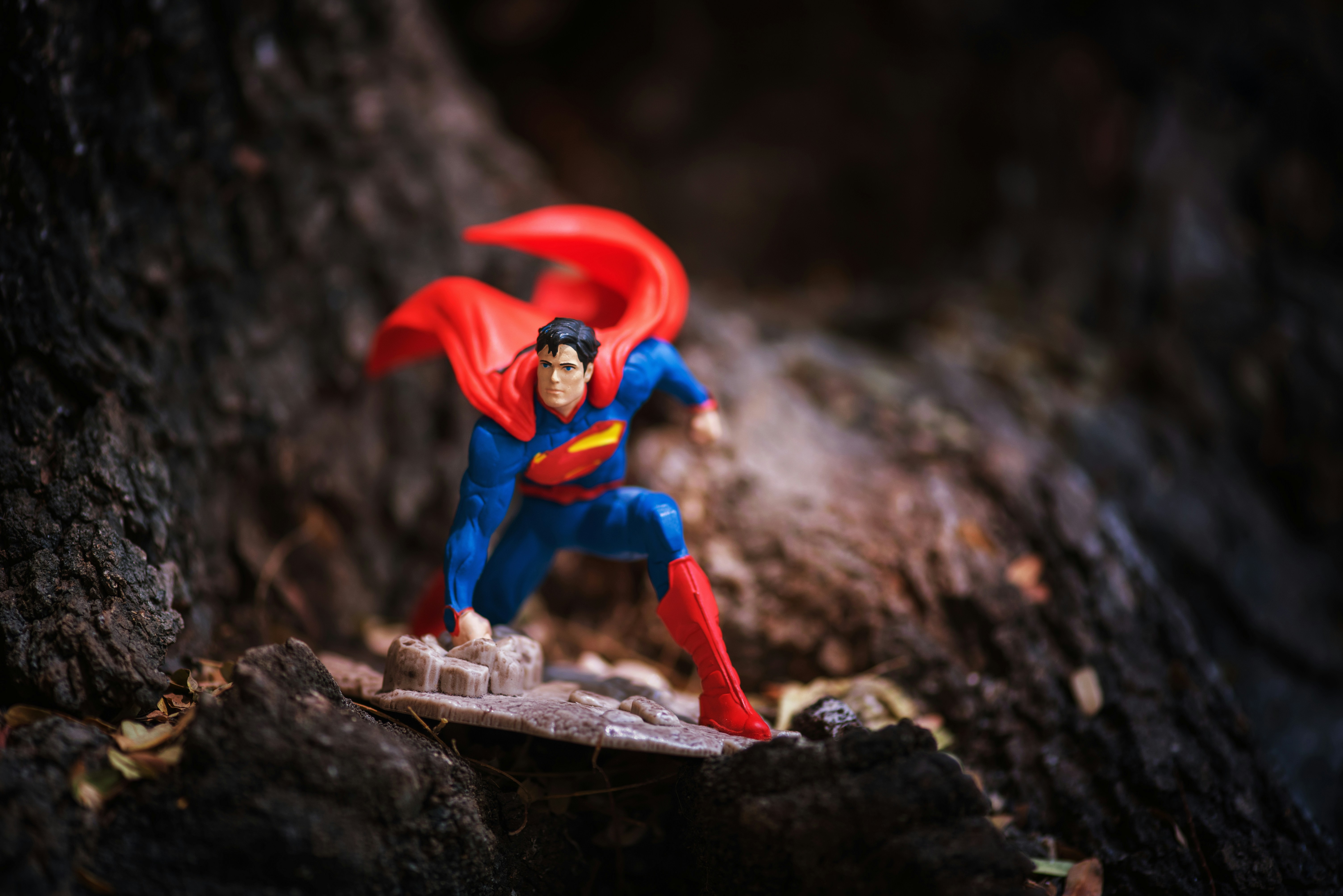 A superman action figure is posed on a rock photo – Free Filming Image ...