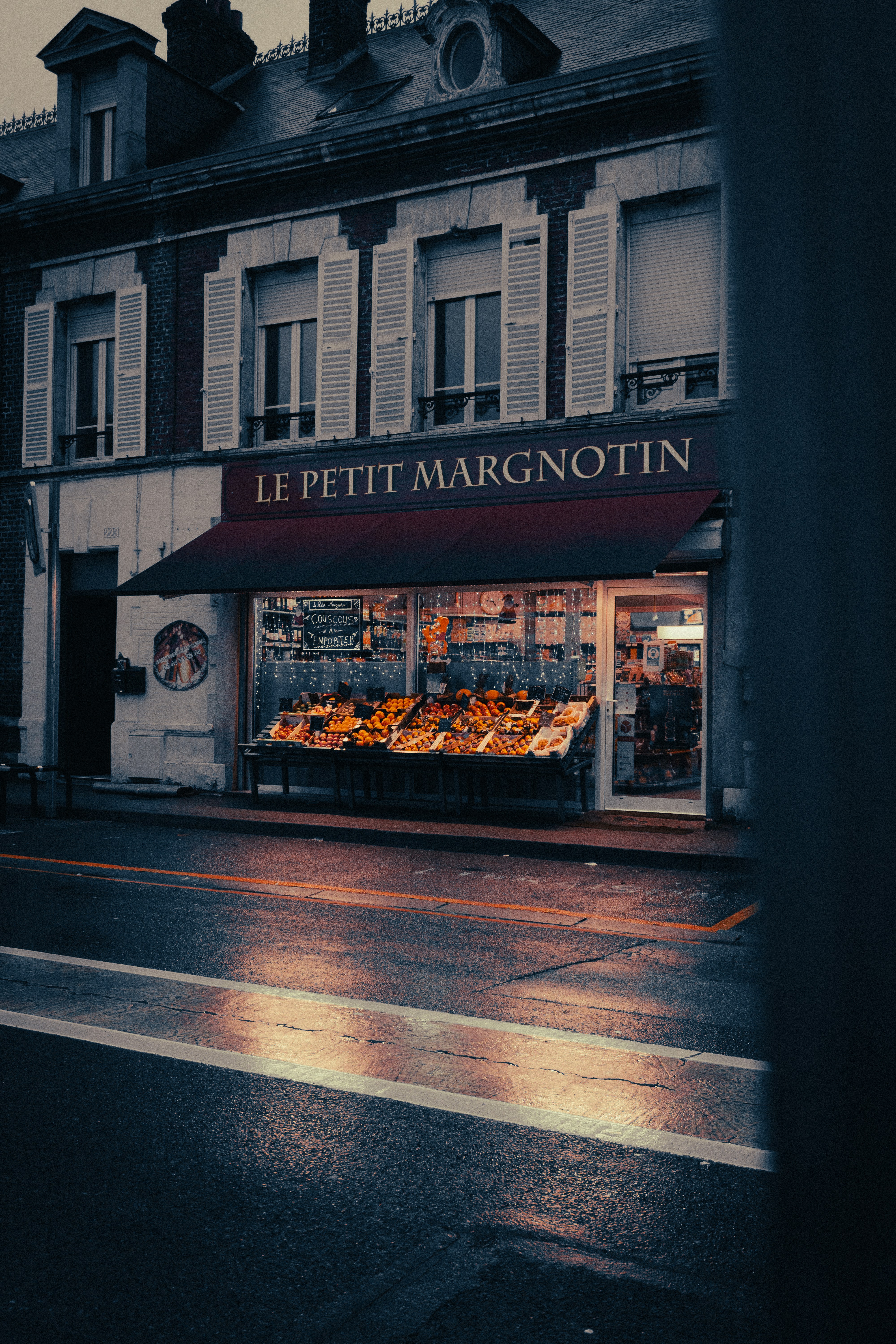 a street corner with a store on the corner