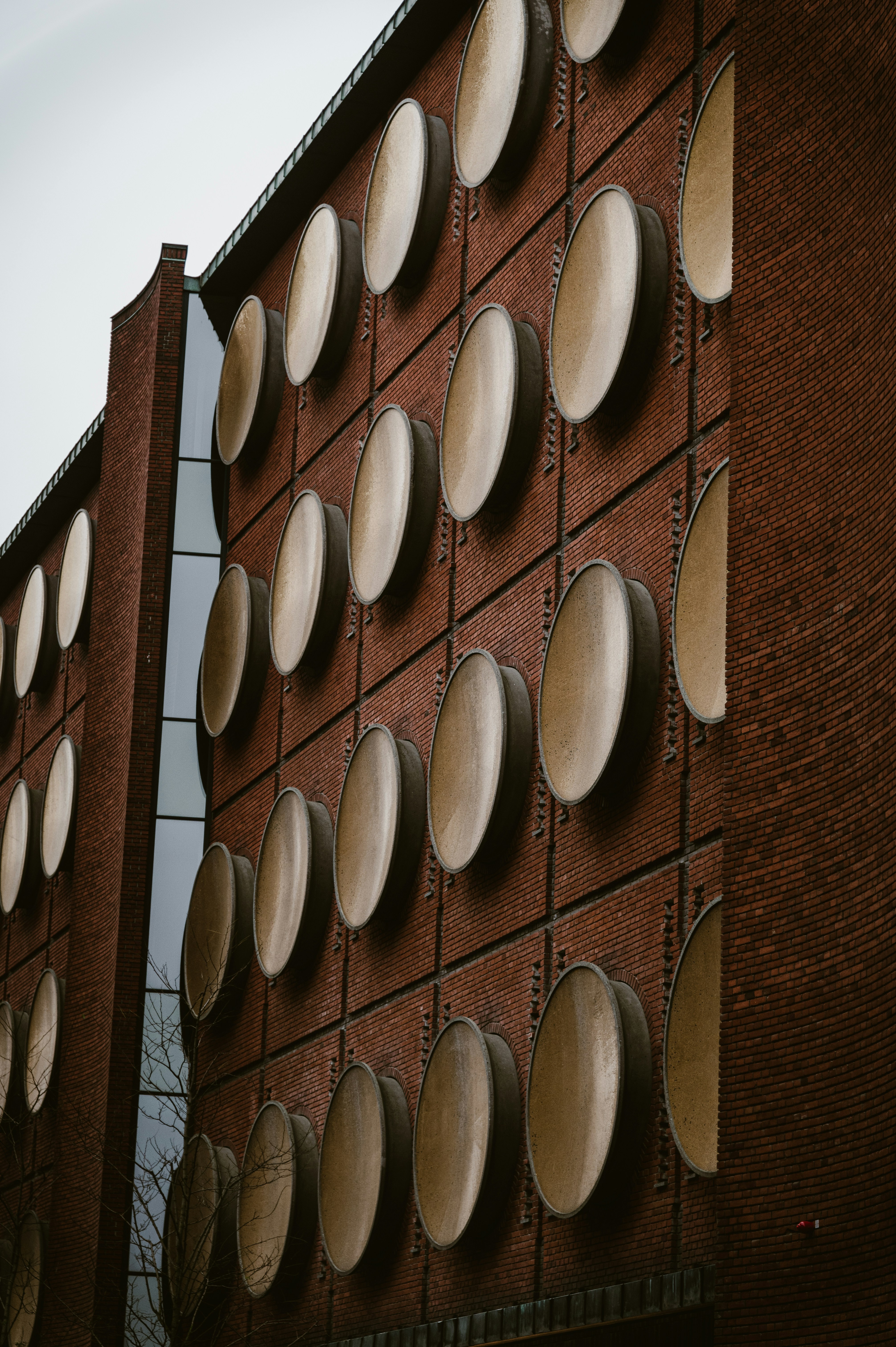 a red brick building with a lot of white circles on it