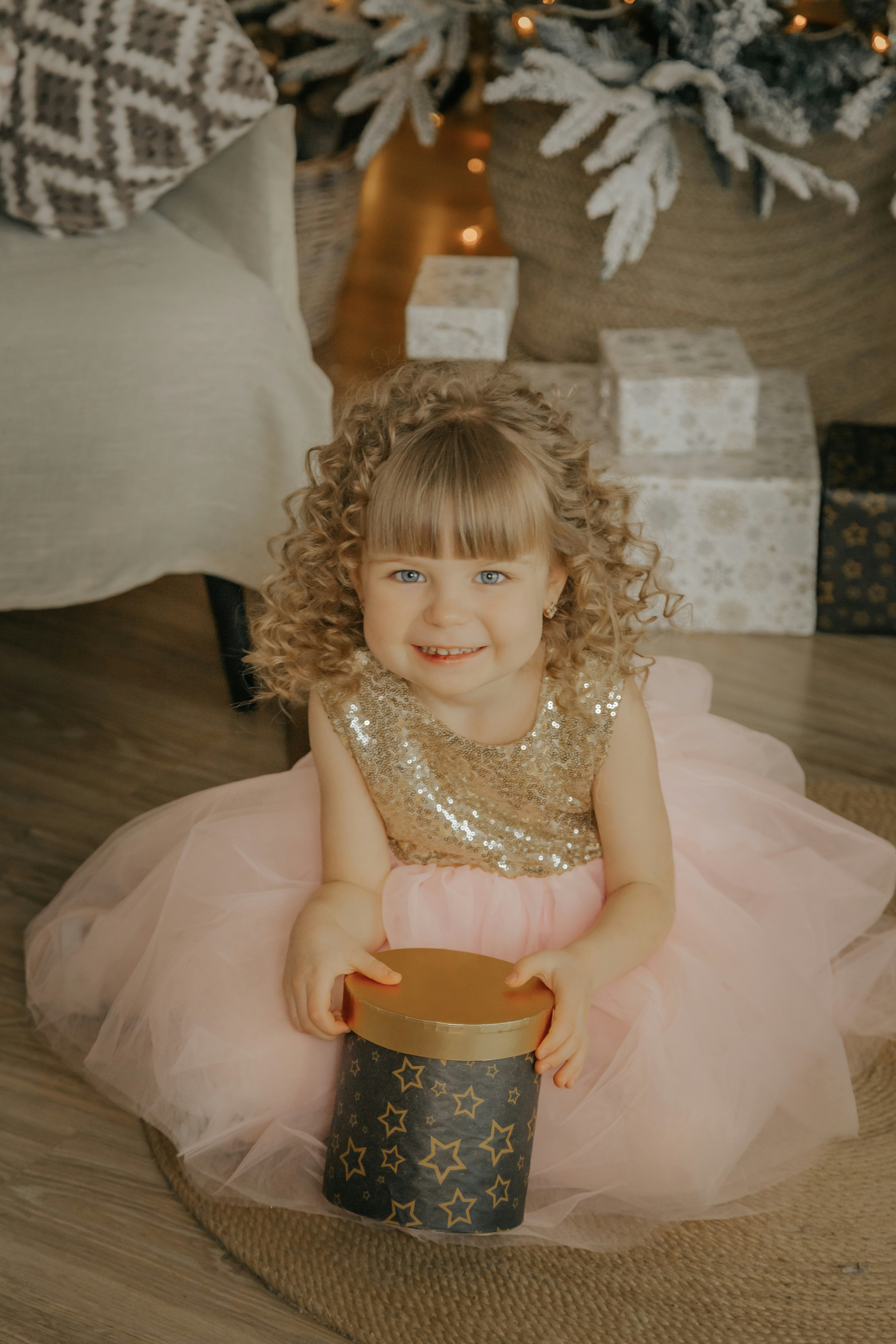 A little girl in a pink dress sitting on the floor photo – Free Russia ...