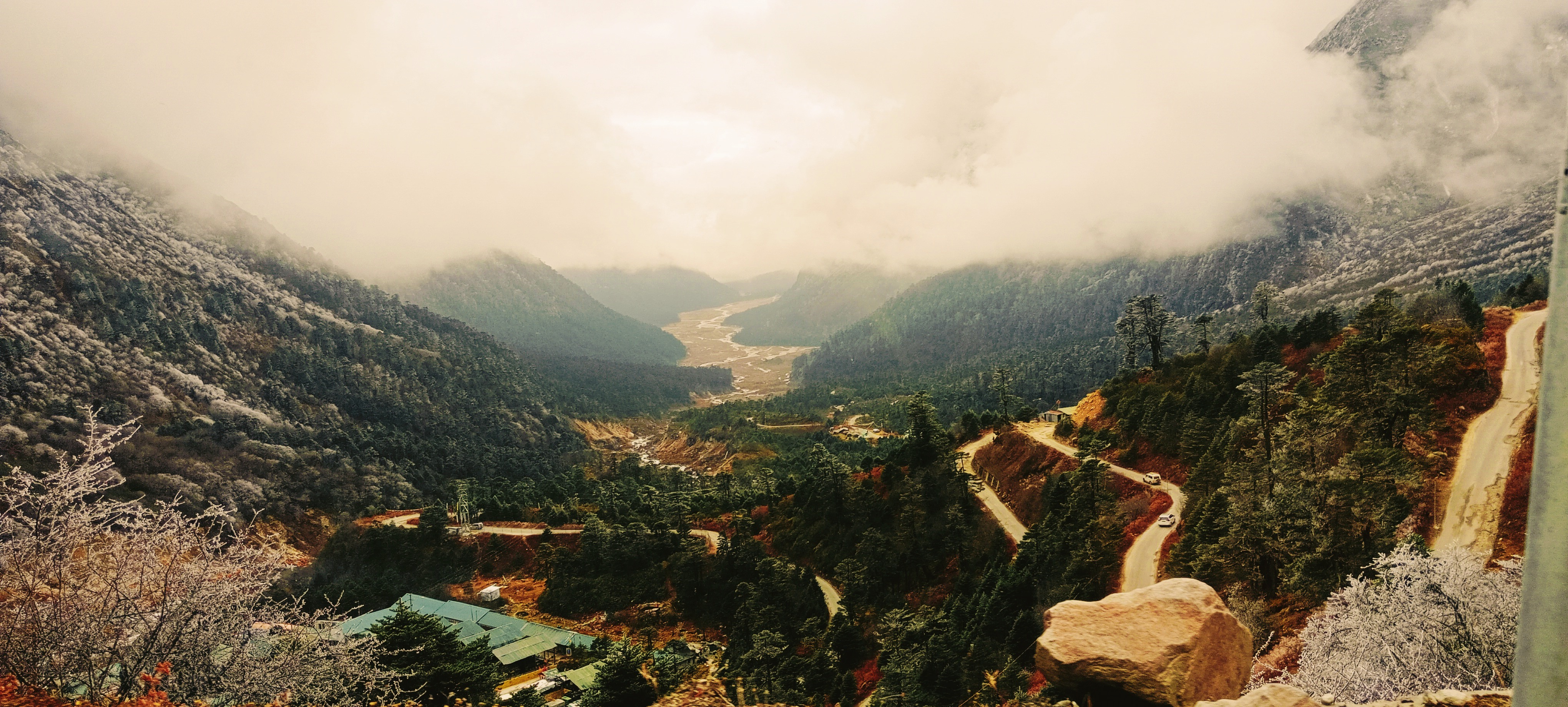 A scenic view of a valley with a river running through it photo – Free ...