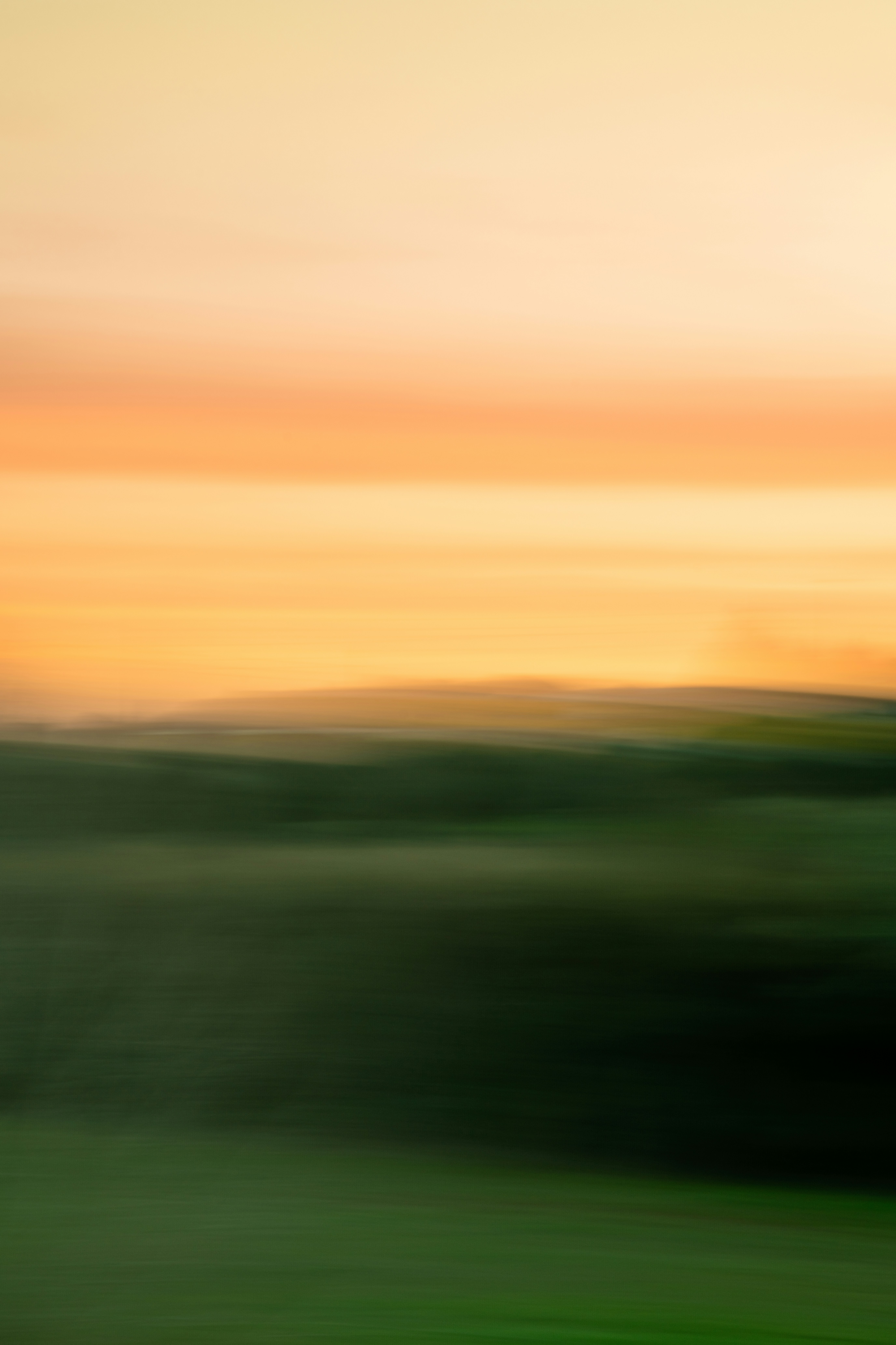 a blurry photo of a plane flying in the sky