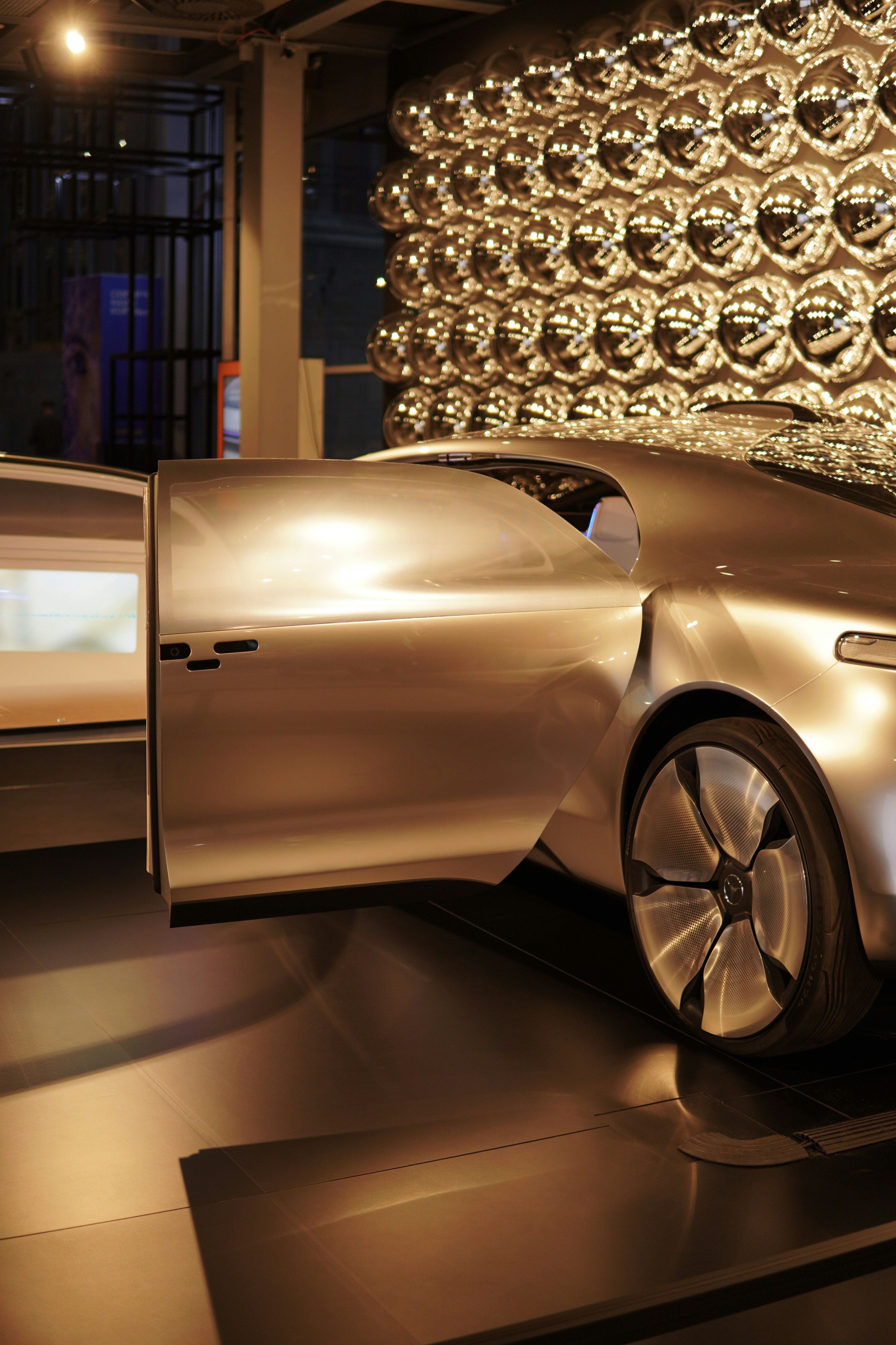 Chrome and Constellations: A Concept Car Emerges Under Golden Orbs