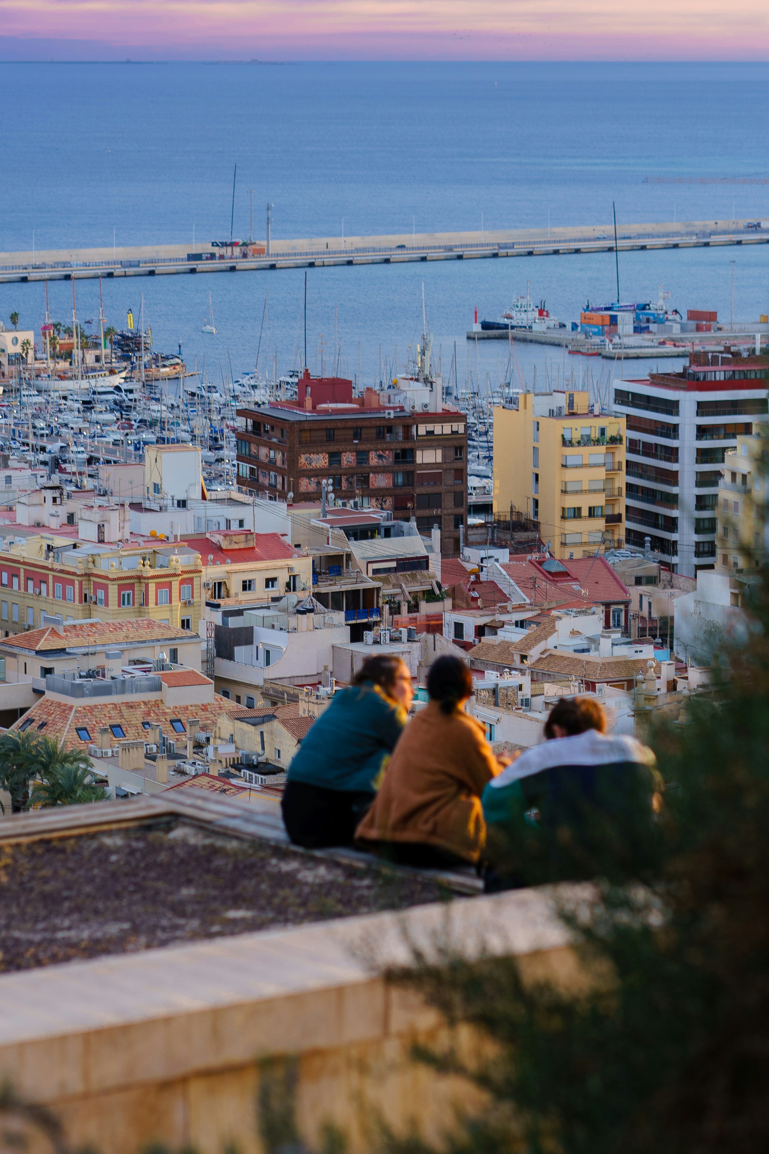 Friends Overlooking a Colorful Coastal City