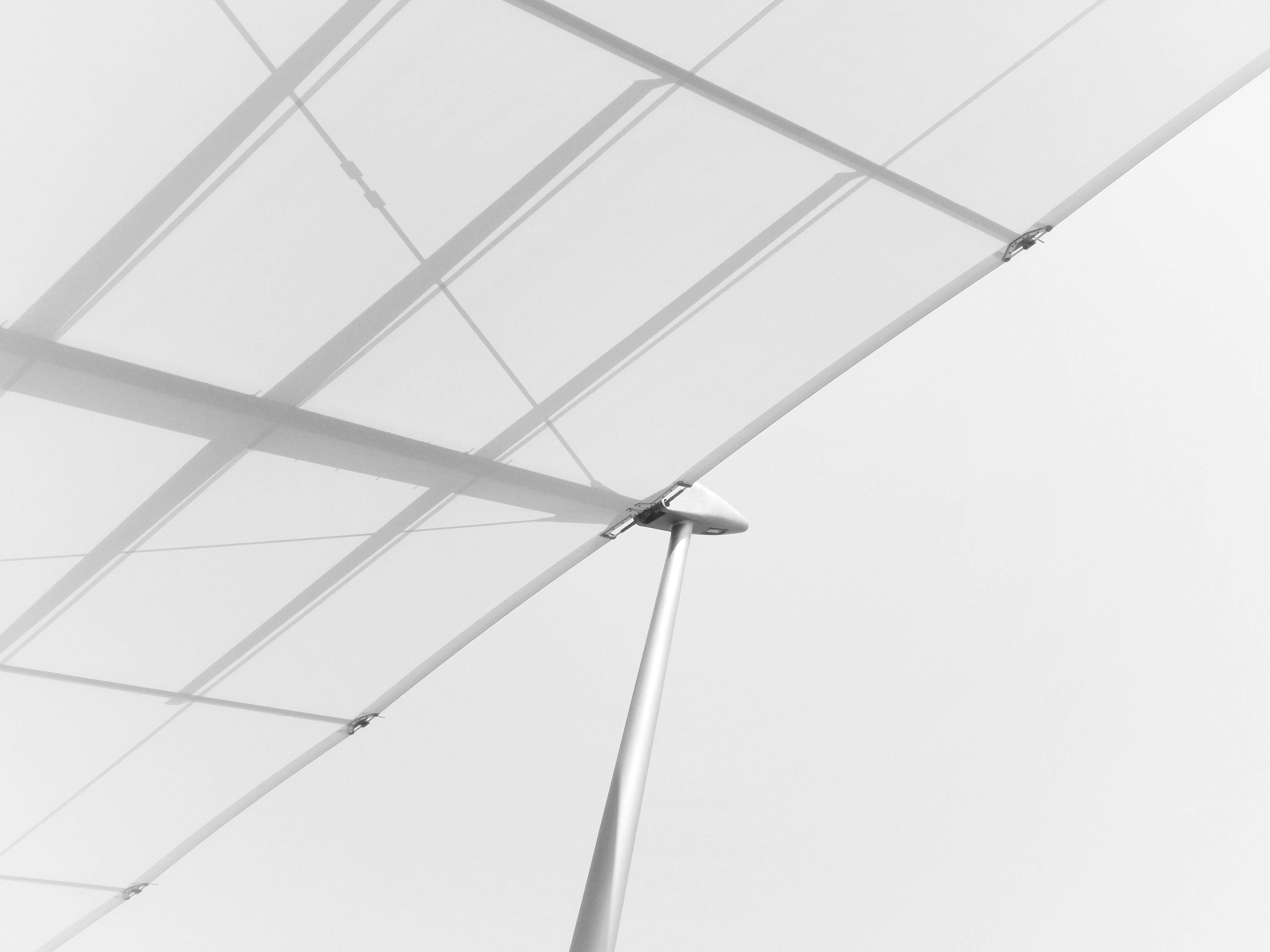 A wind turbine under a white canopy photo – Free Grey Image on Unsplash