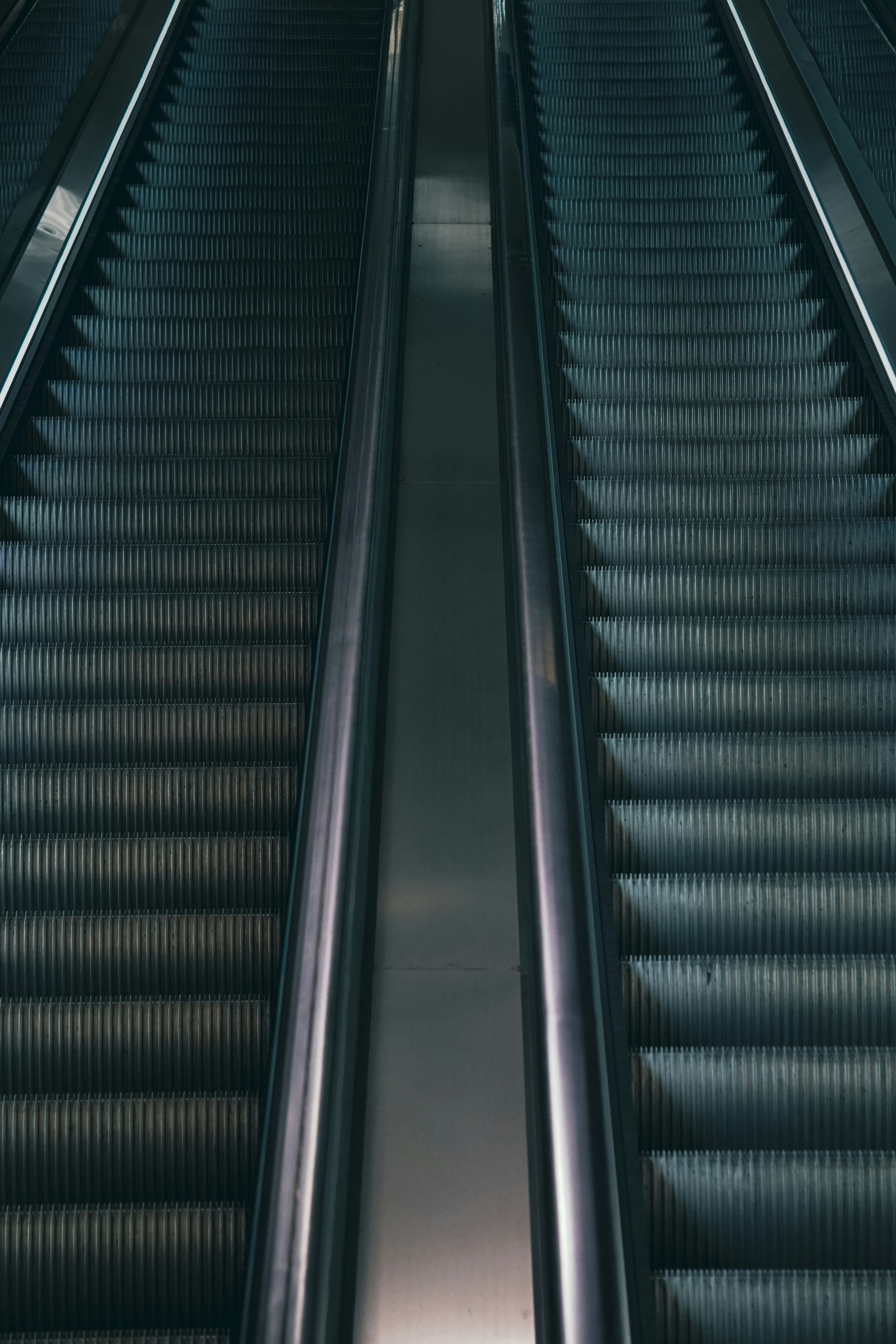 An escalator in a subway station with two escalators photo – Free Grey ...
