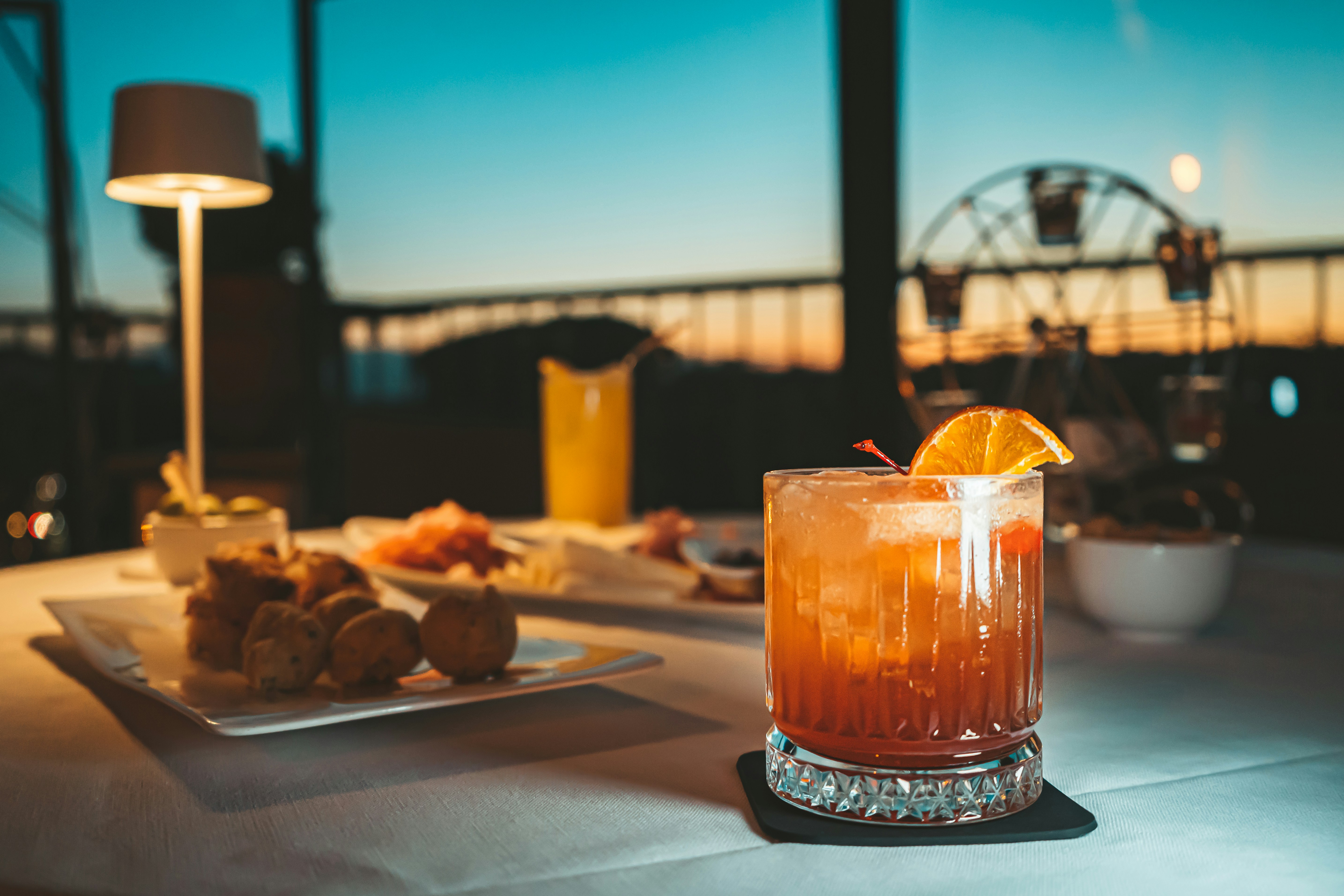 Twilight Spritz by the Window: Amber Glow and a Quiet Table