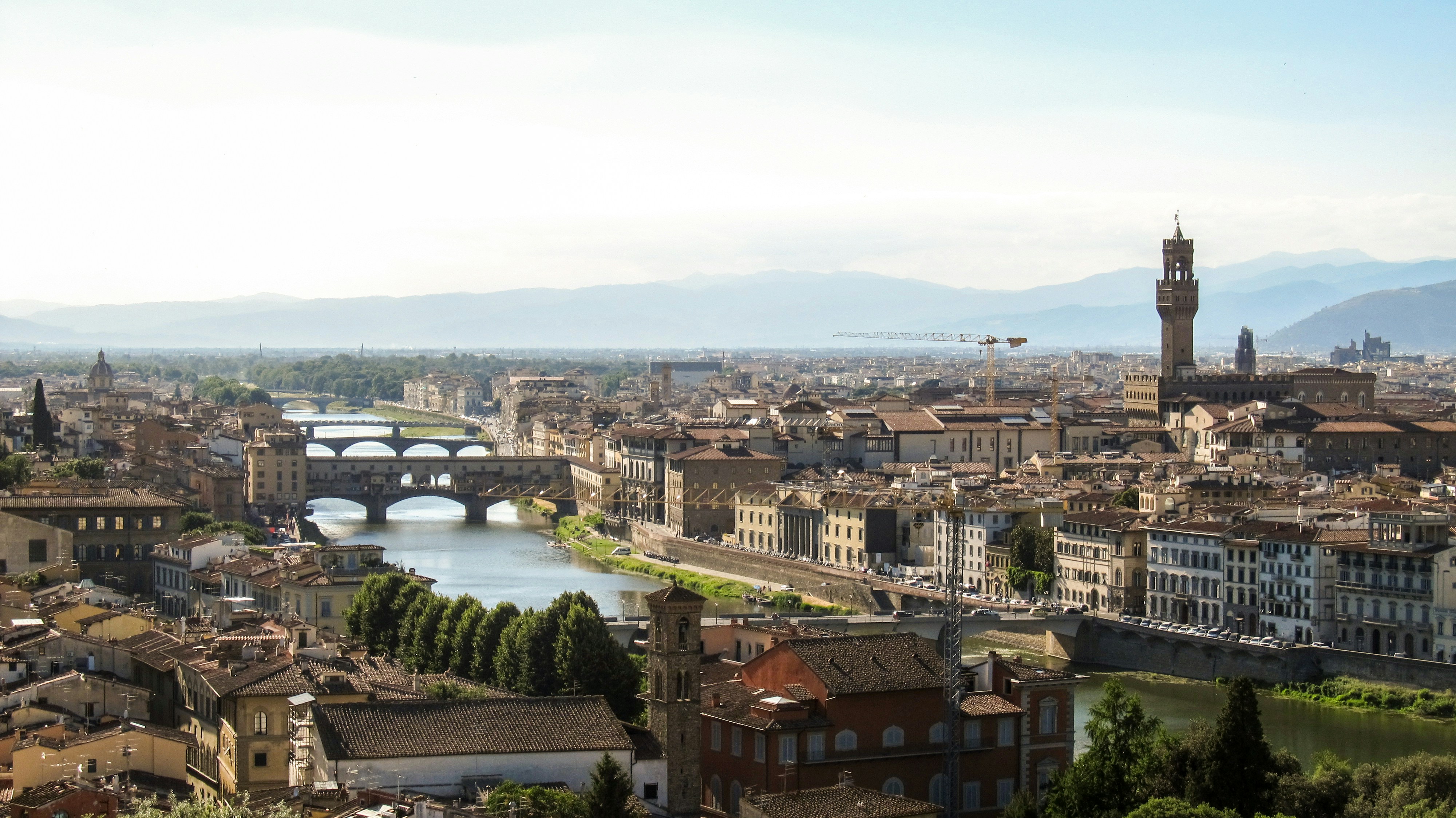 A river running through a city next to a bridge photo – Free Landscape ...