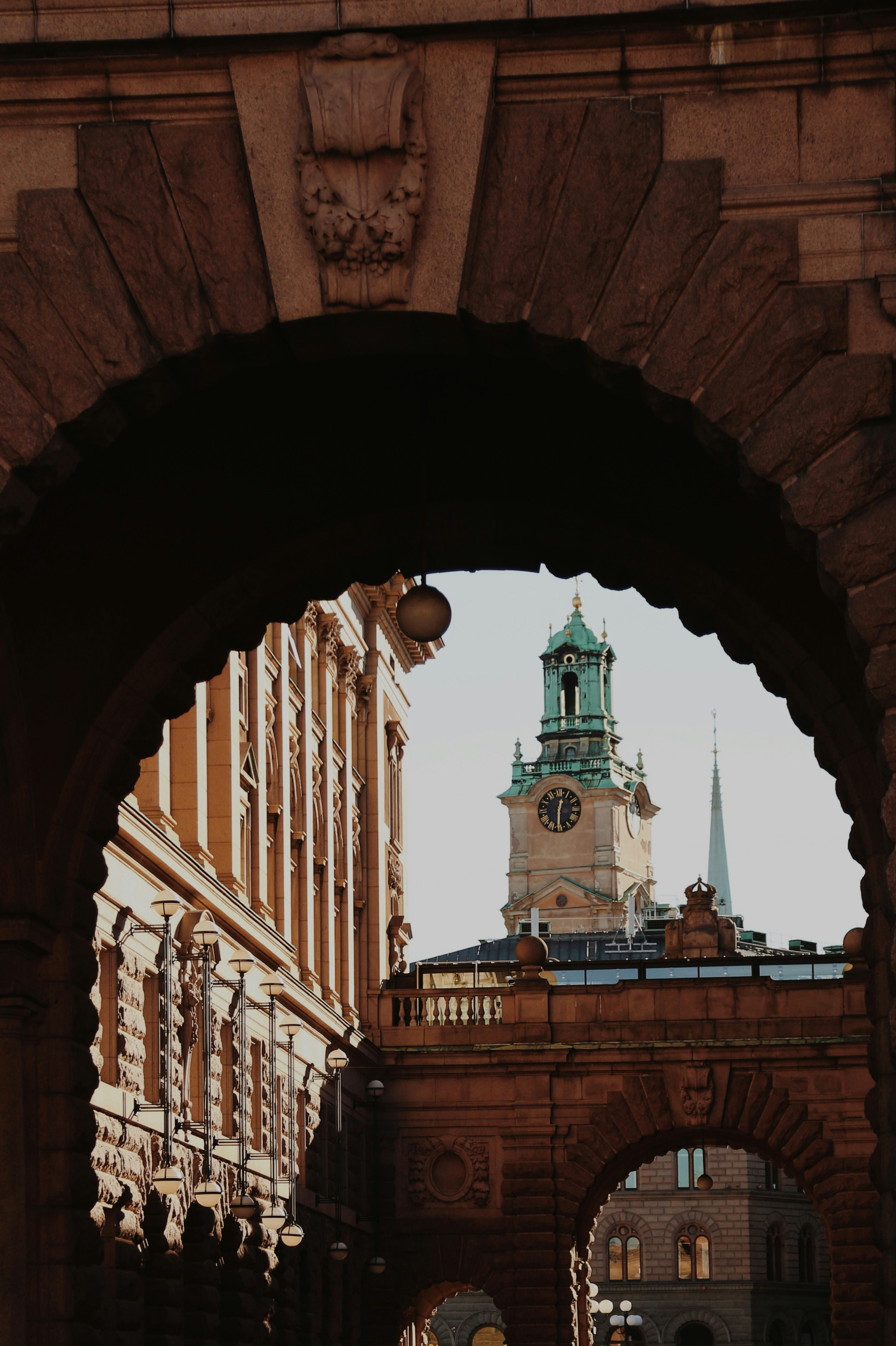 A large clock tower towering over a city photo – Free Architecture ...