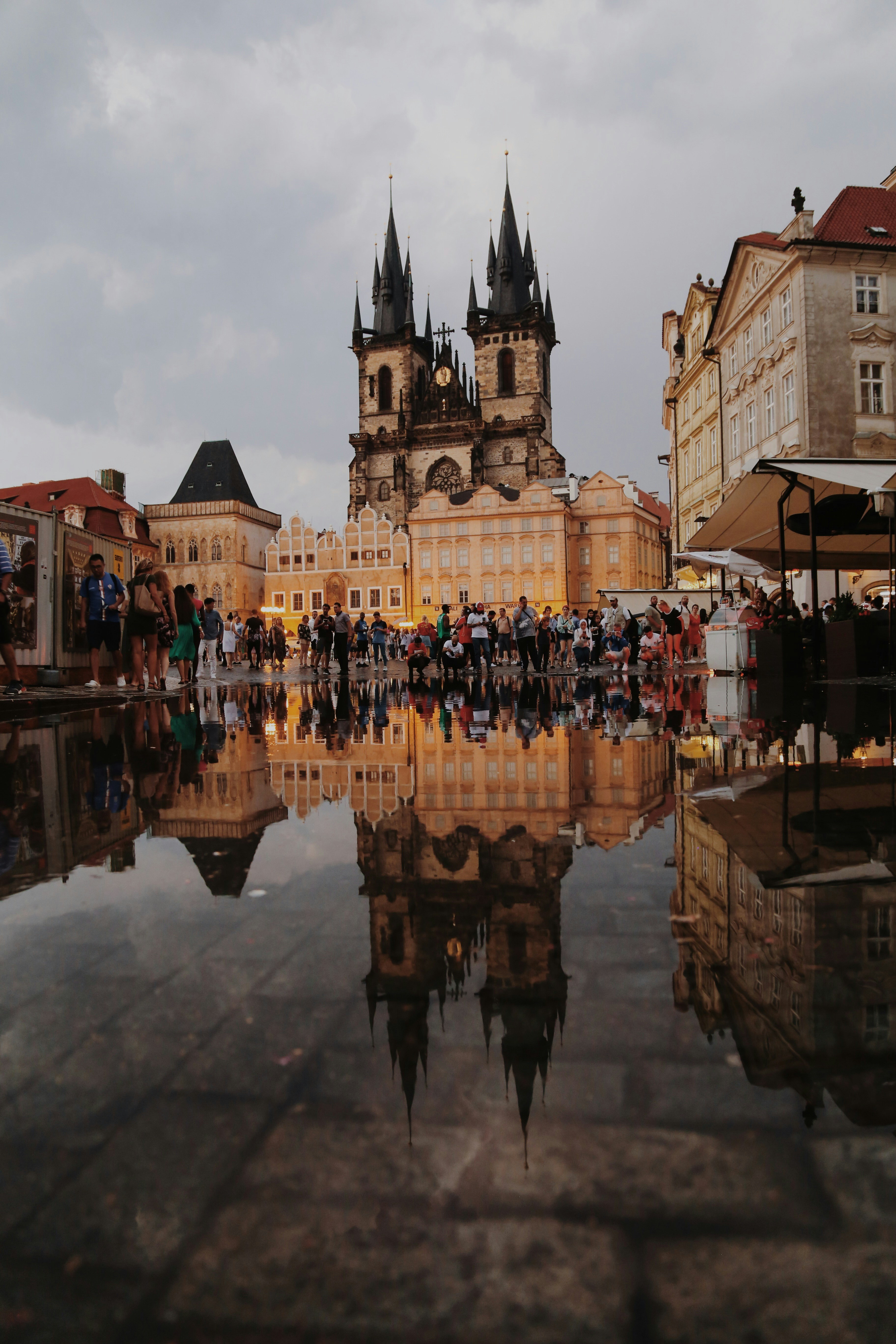 a group of people standing in front of a large building