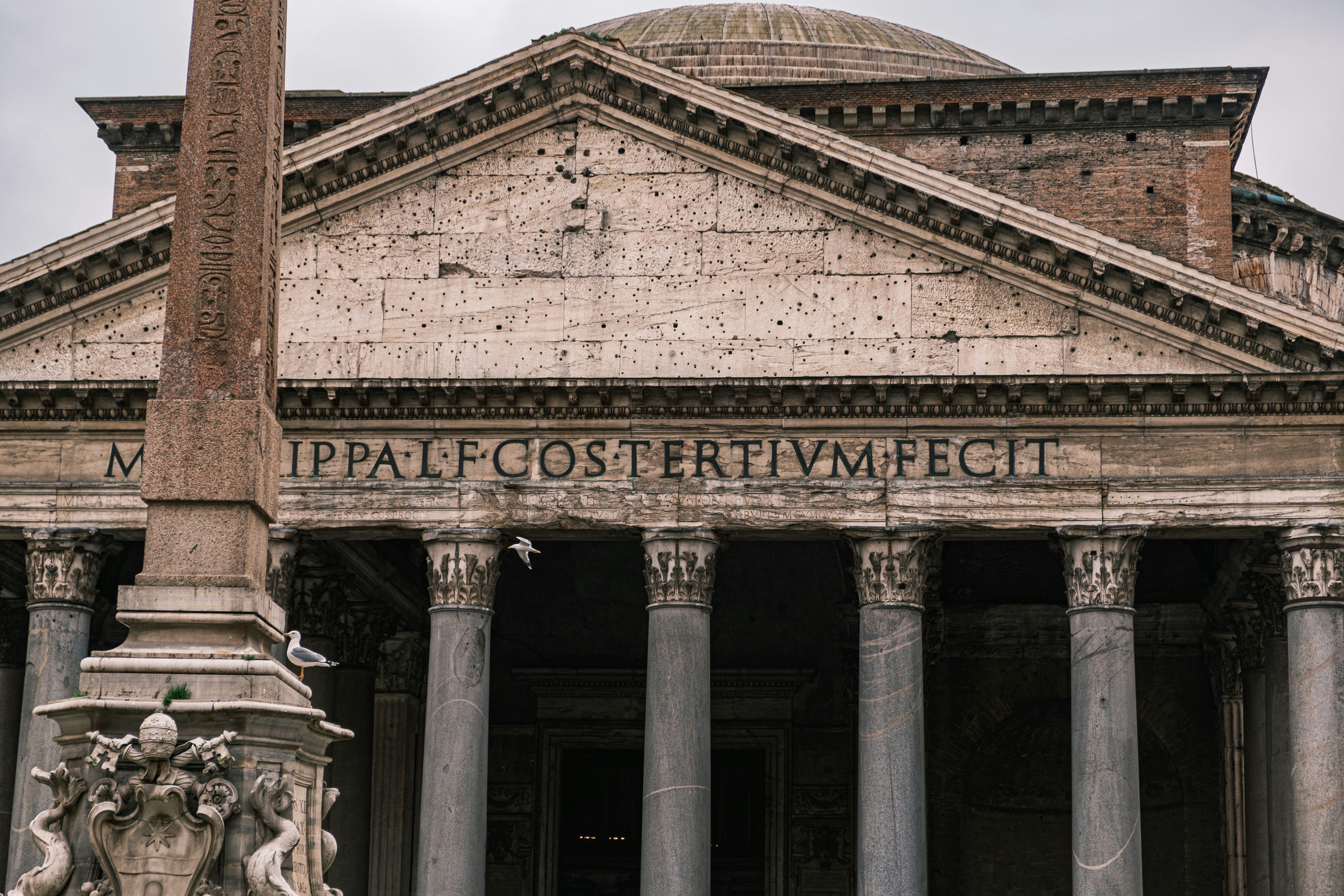 Ruins and Obelisk: The Basilica’s Weathered Facade in Soft Dawn Light