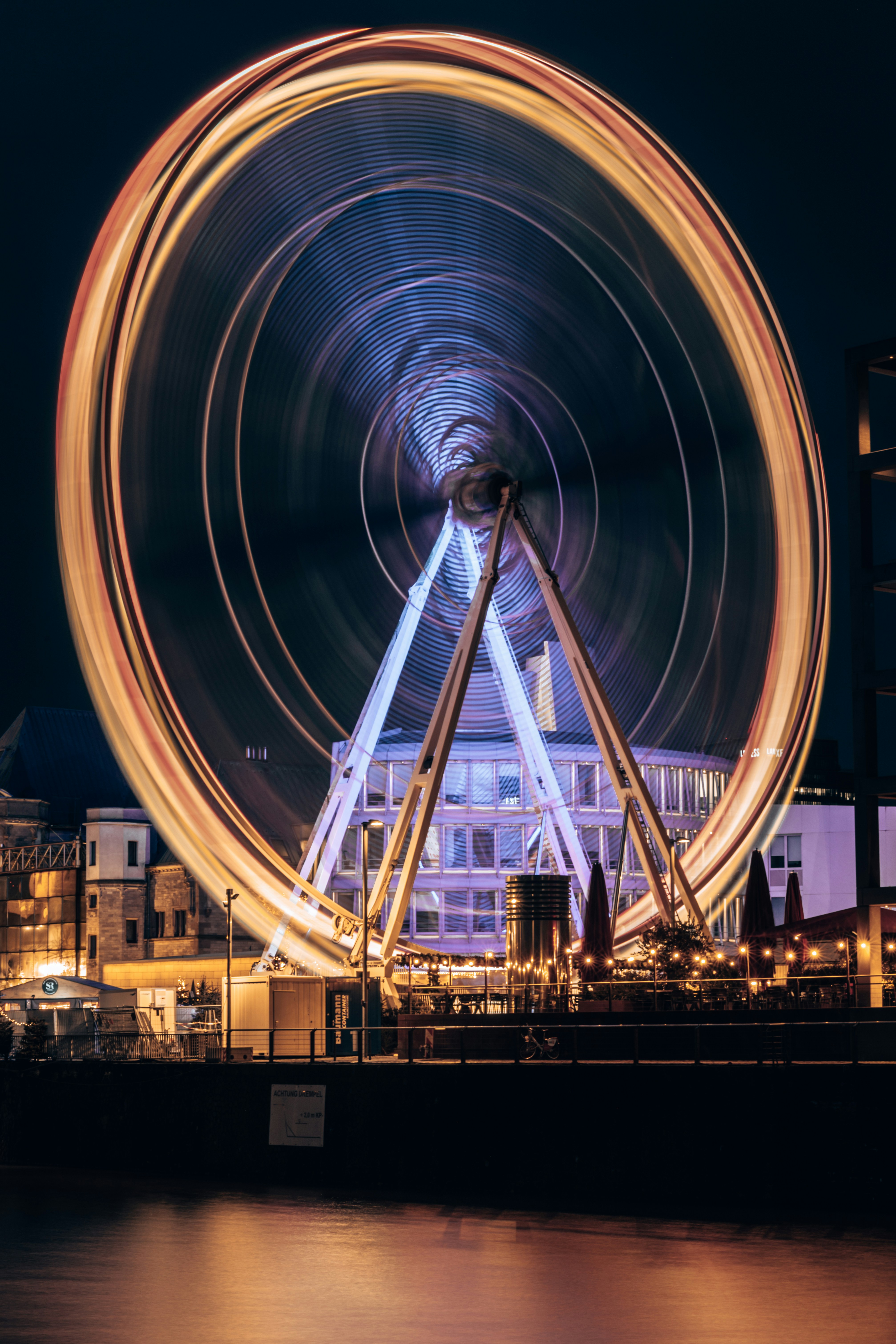 Midnight Ferris Wheel: Circular Veil of Light Over the City