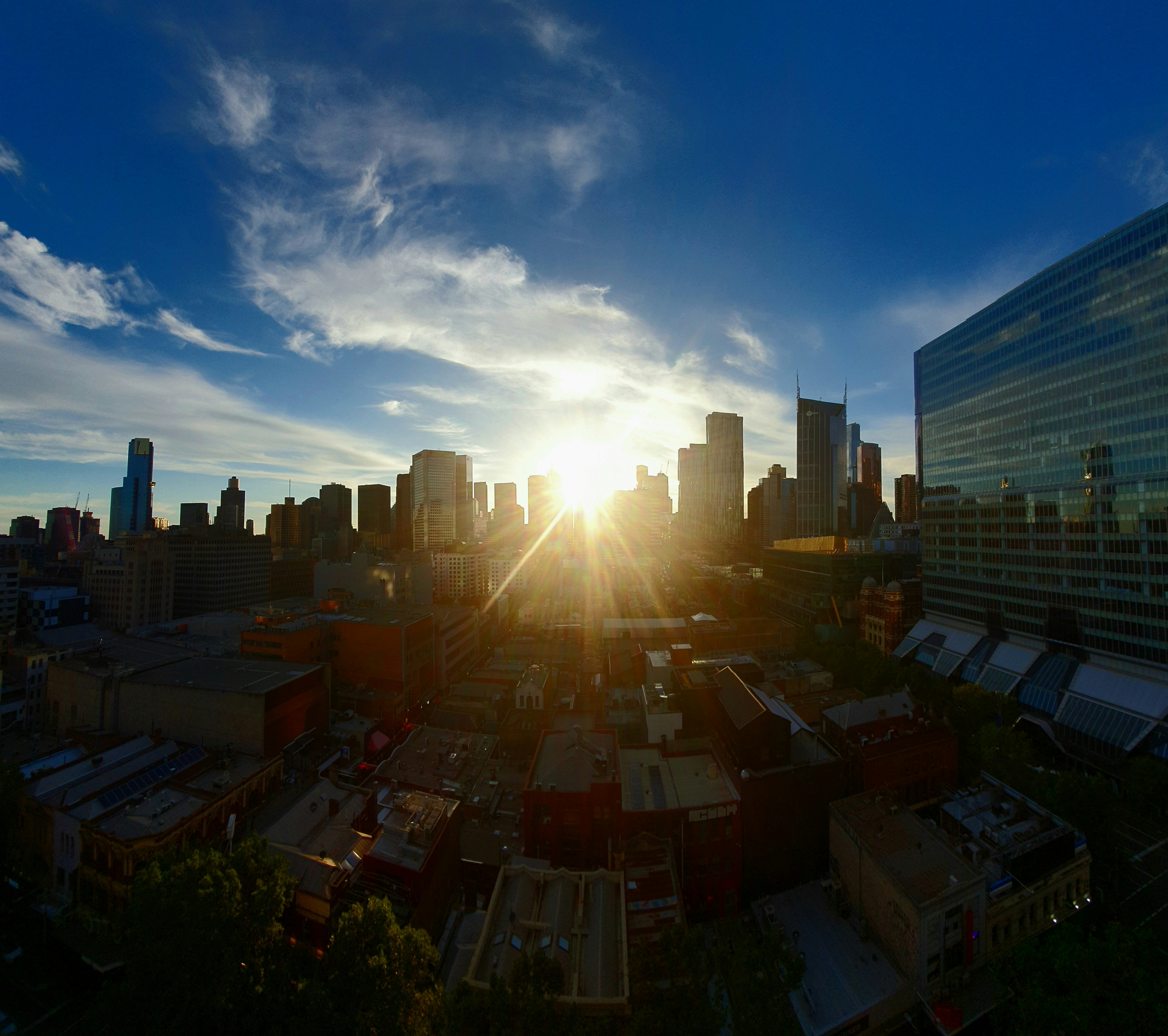 Sunrise Over City: A Golden Break Between Towers