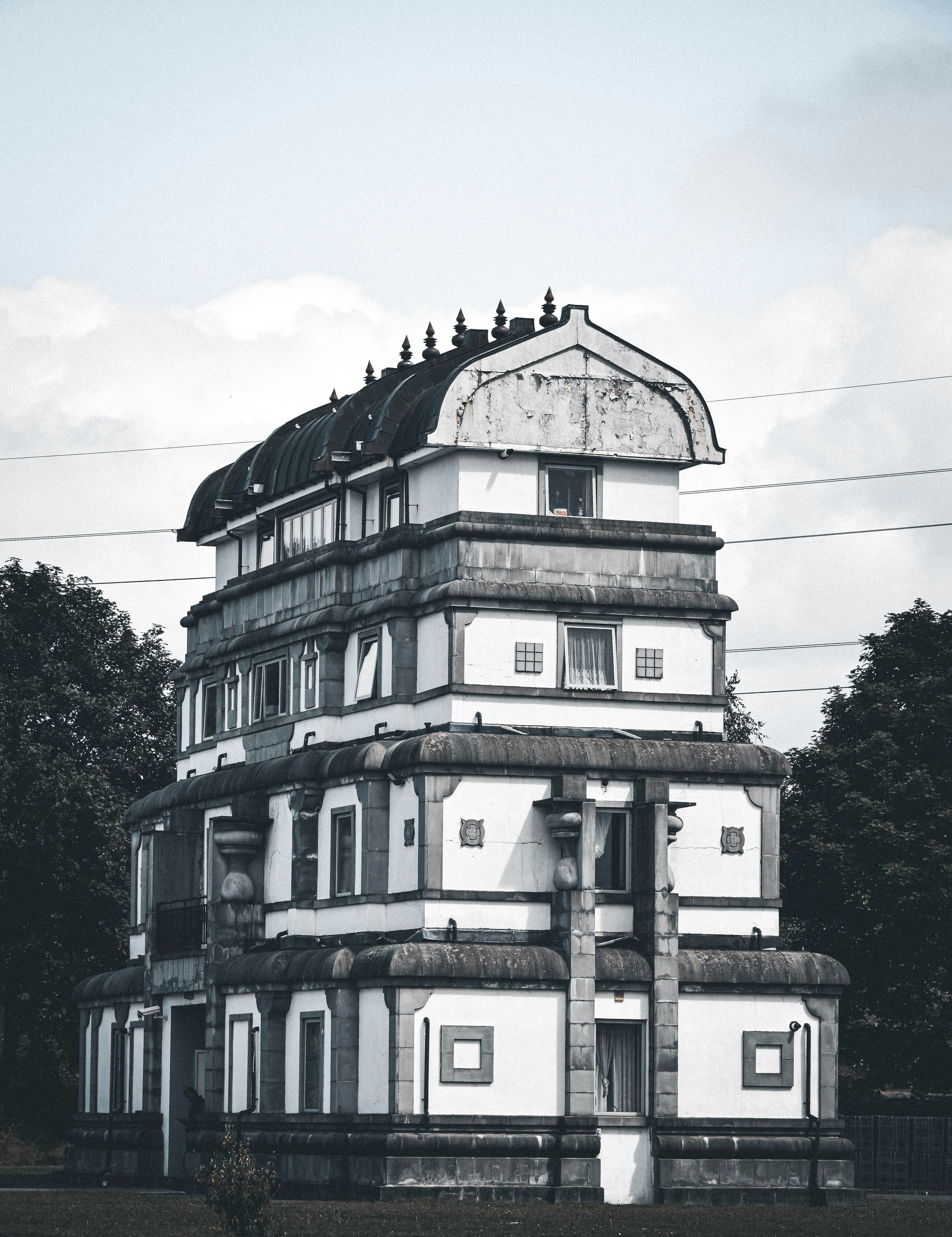 an old building with a clock on the top of it