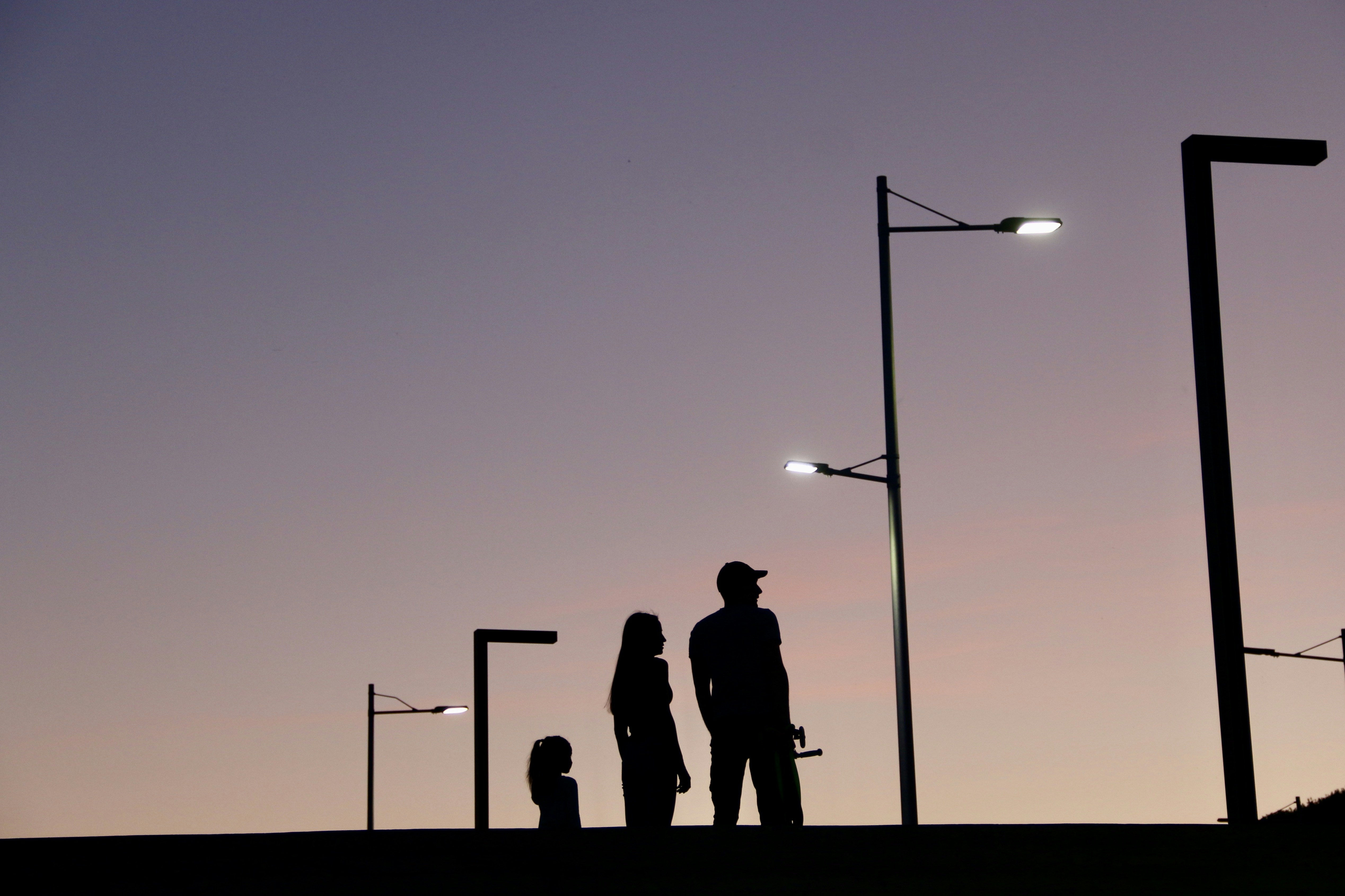 A man and a woman are standing under street lights photo – Free Россия ...