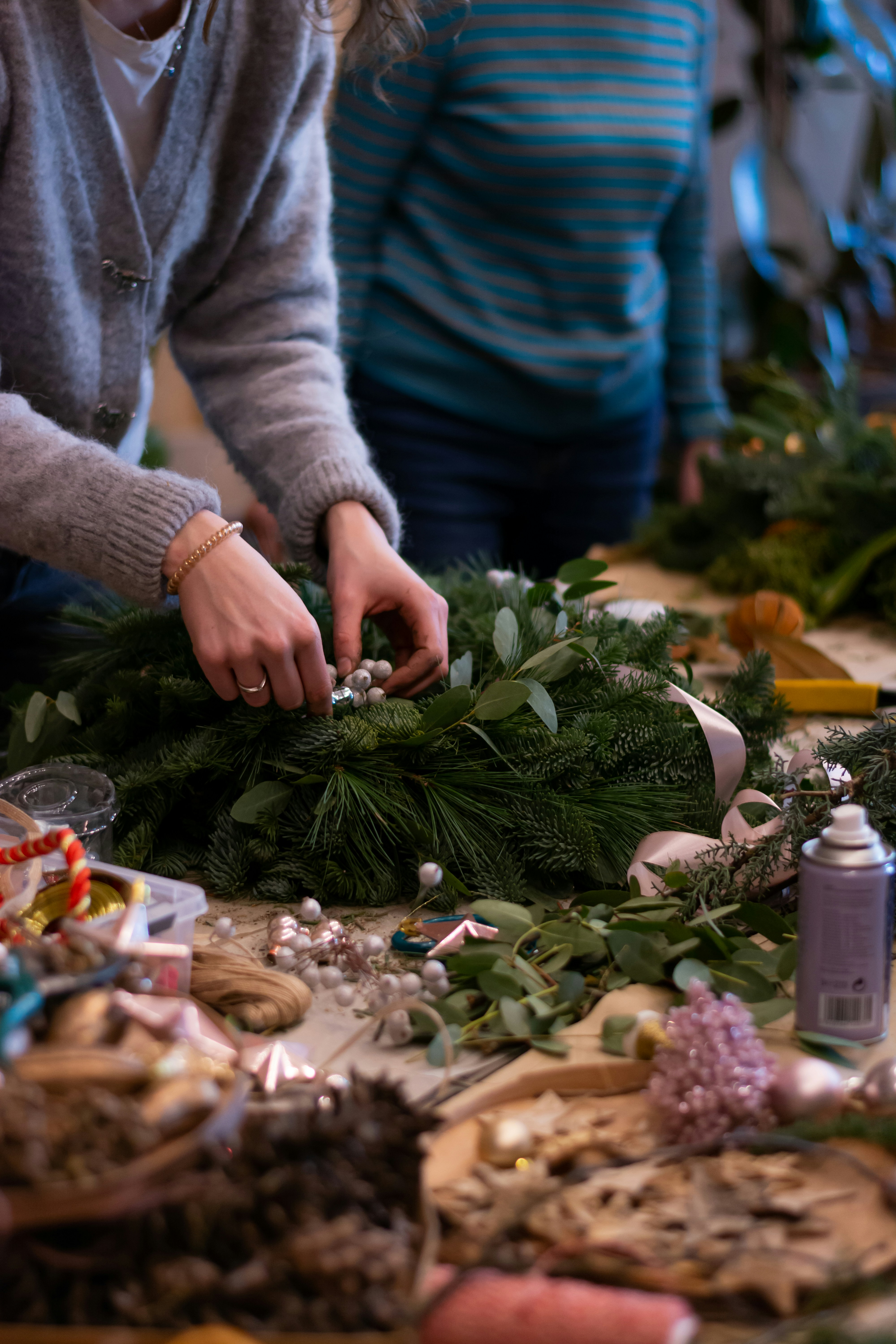 Hands at Work: Crafting a Festive Greenery Wreath
