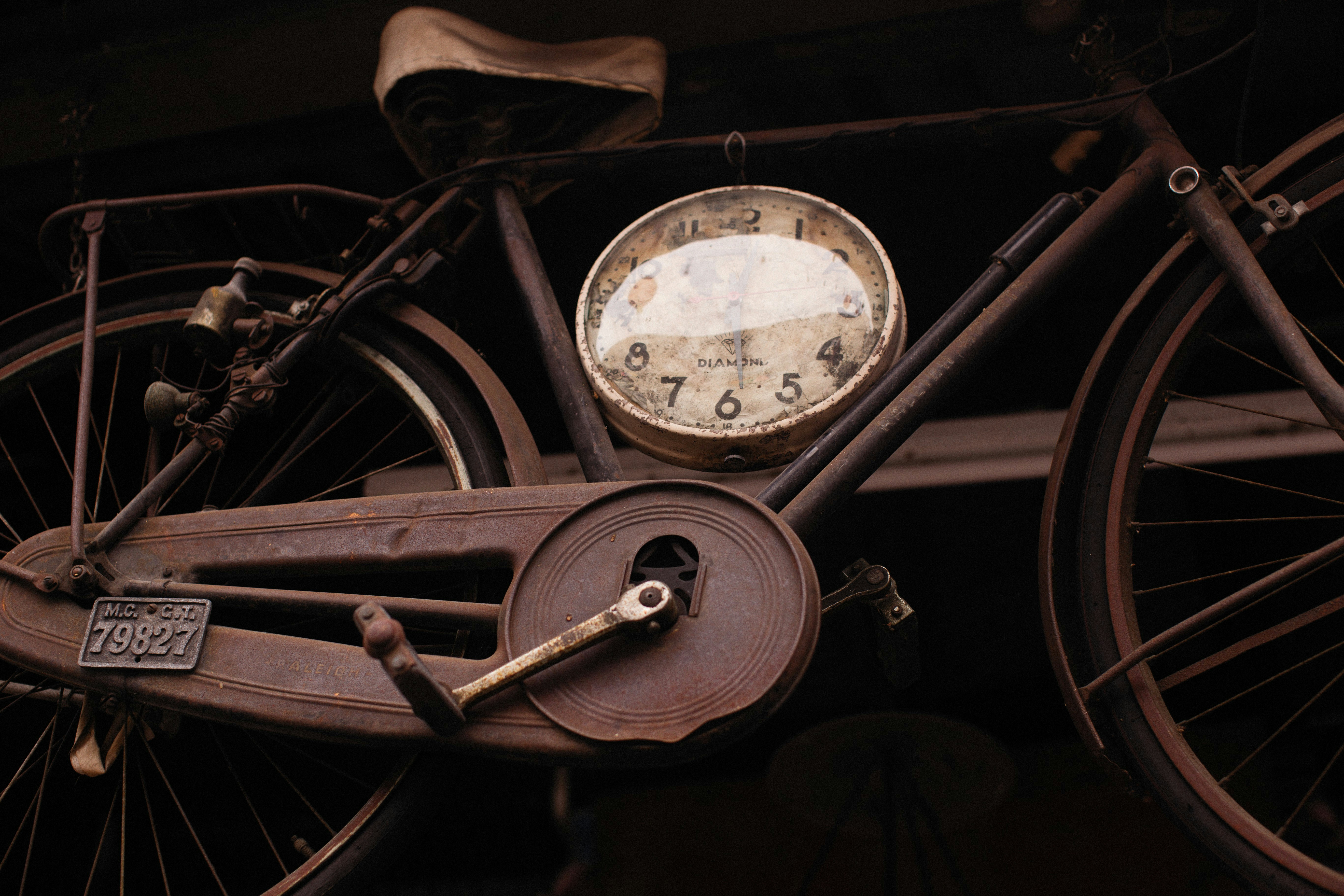 a close up of a bike with a clock on it