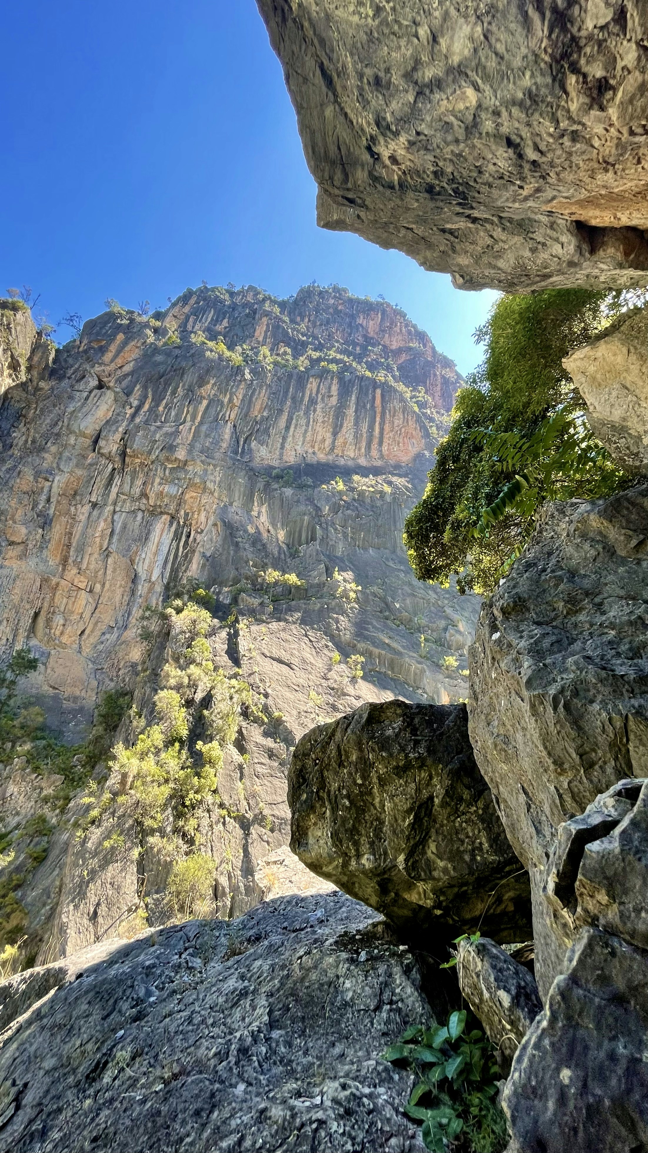 A view of a rocky mountain from below photo – Free Australia Image on ...