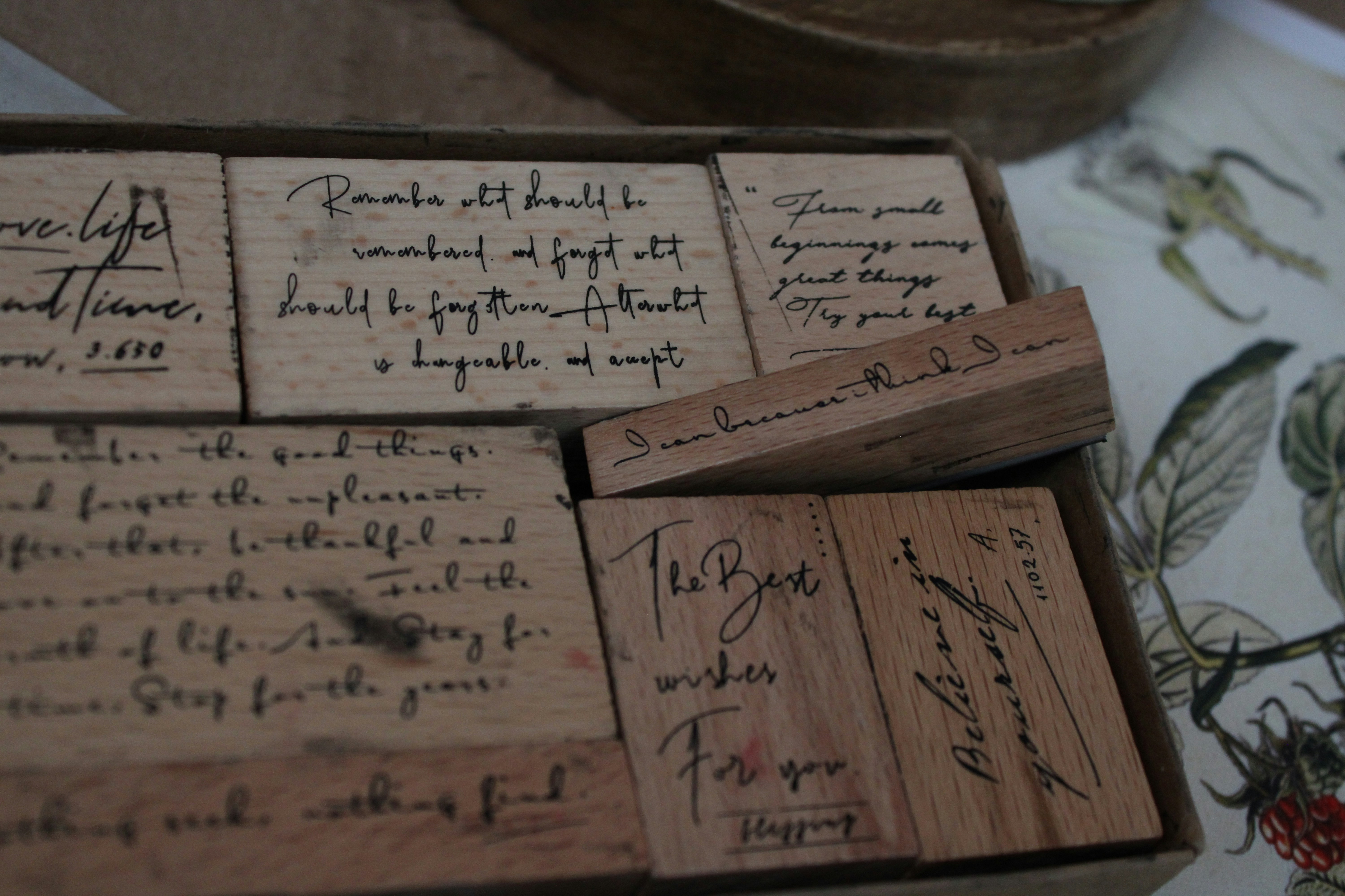 A box of wooden stamps with writing on them photo – Free Stamp Image on ...