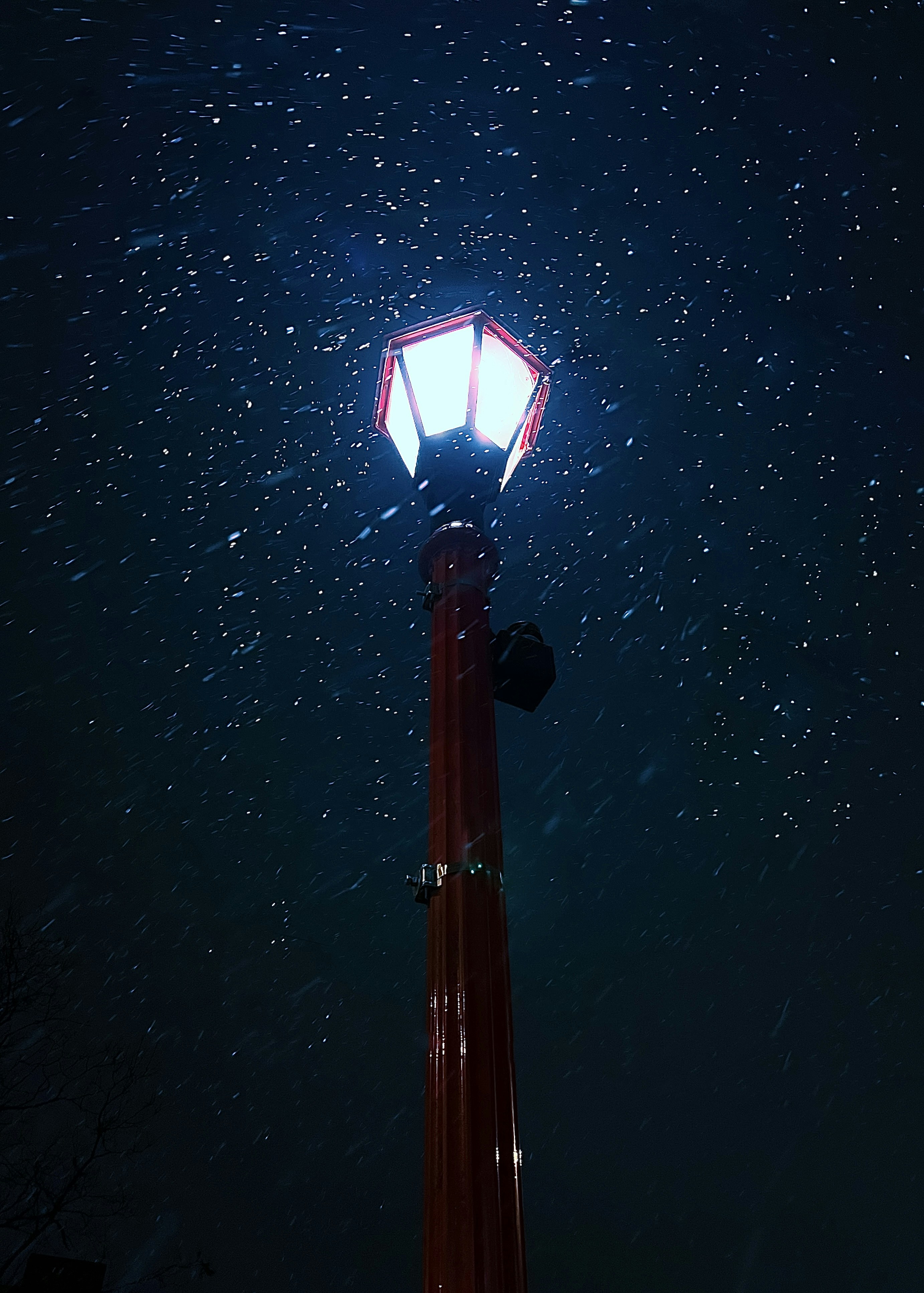 Blue Lantern in a Snowfall: Nightlight on a Red Post
