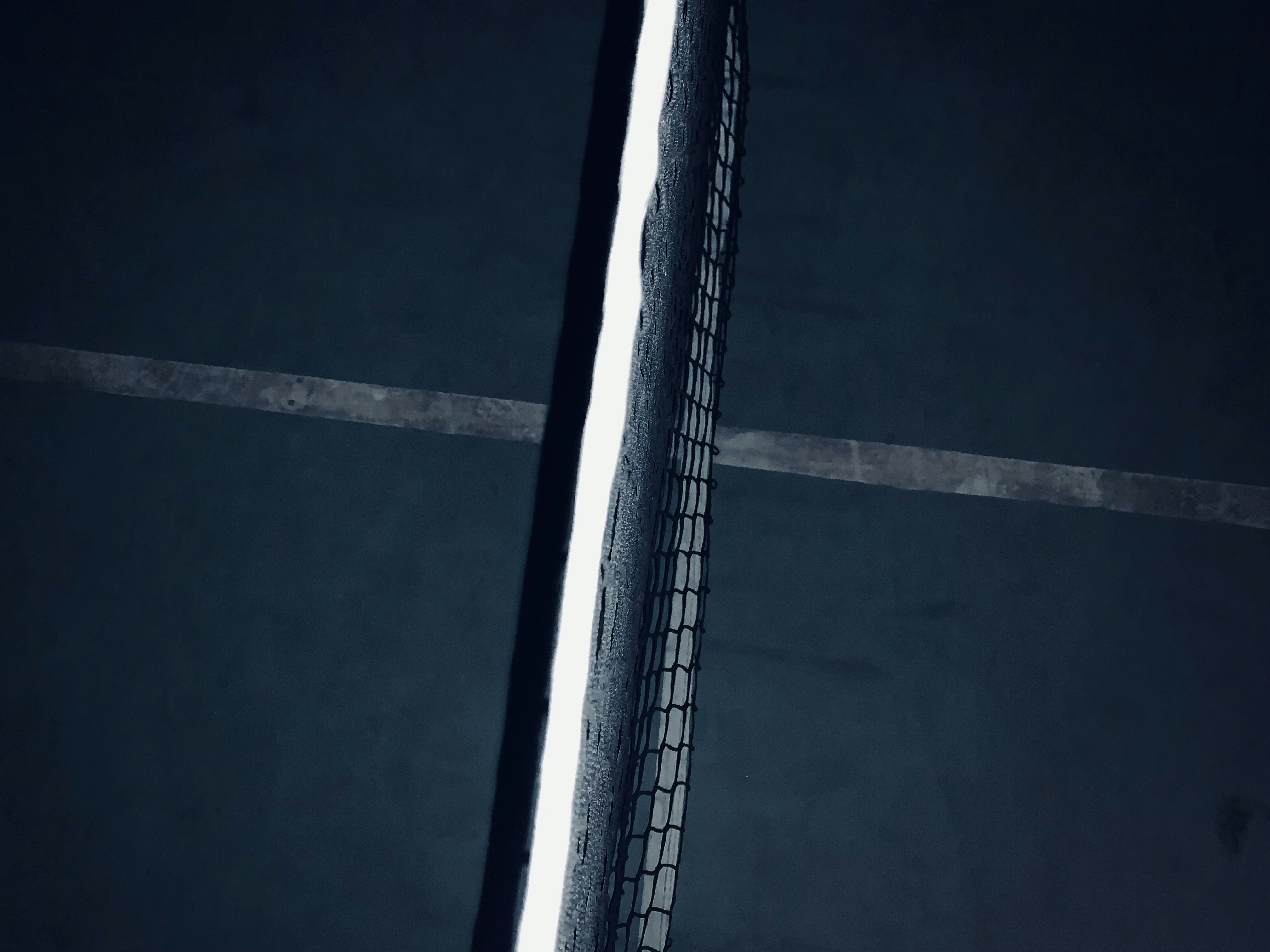 a black and white photo of a tennis racket