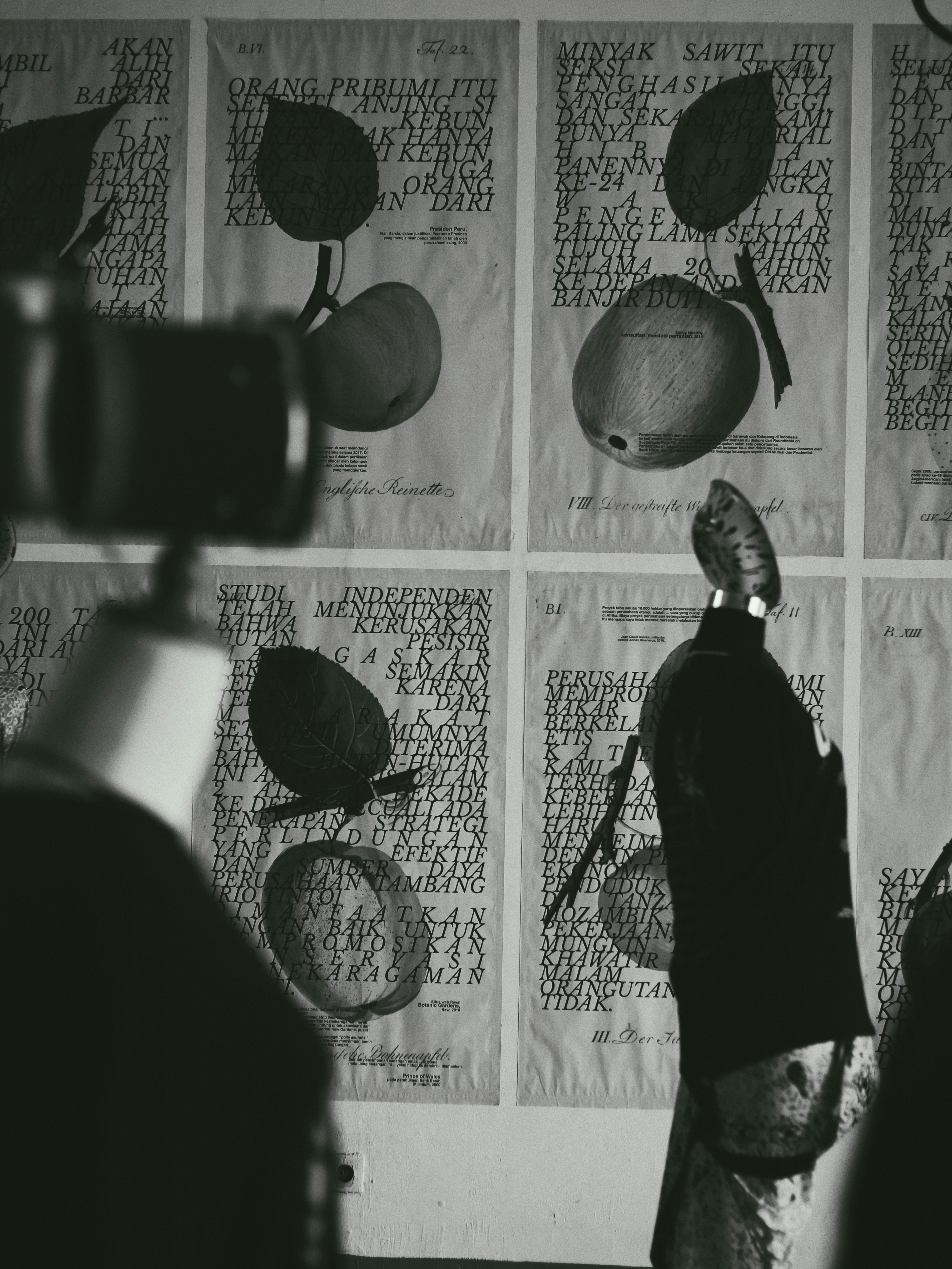 Stencil of Silence: a Portrait Amid Posters of Fruit and Shadows
