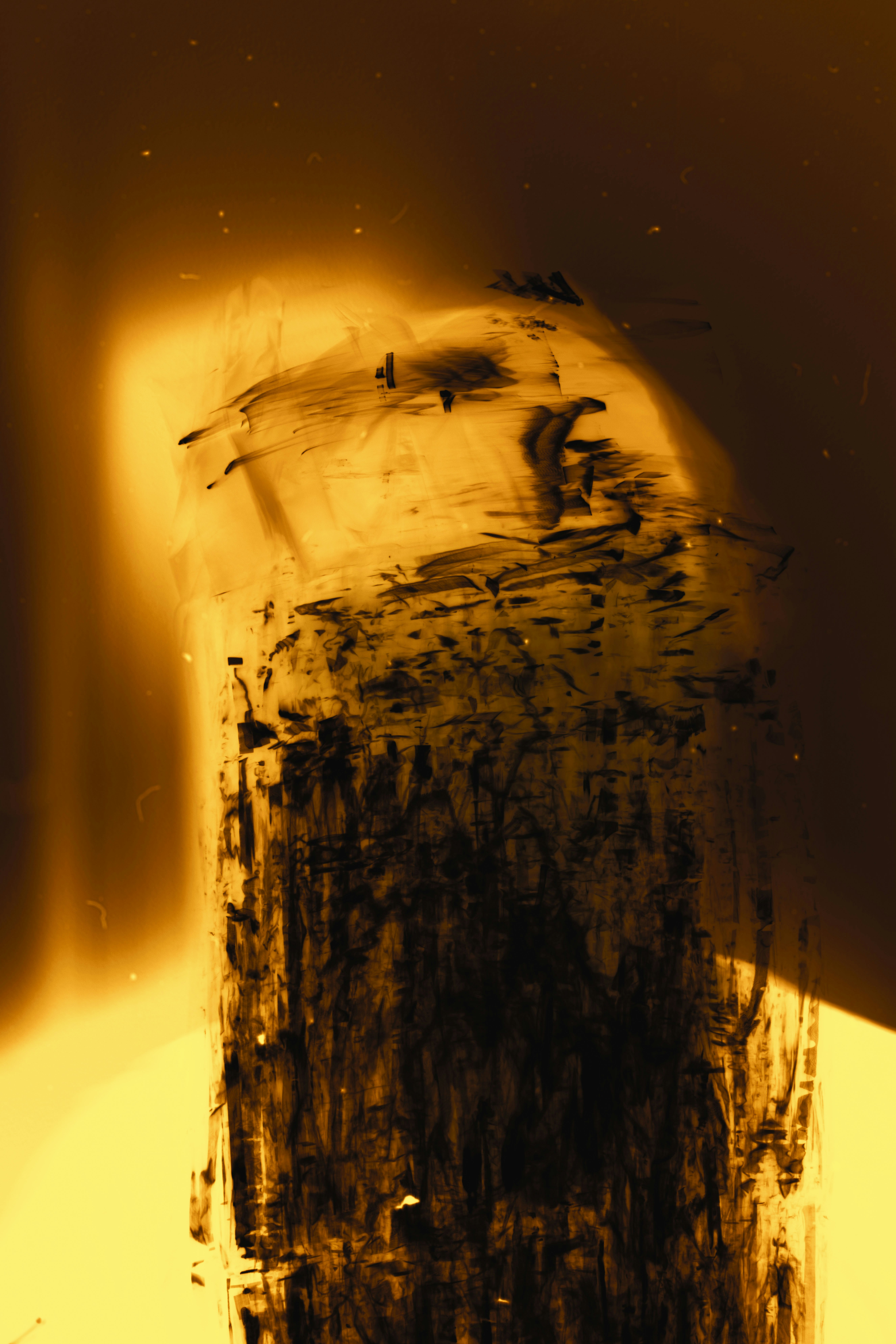 Glowing Amber Core: A Charred Prism Emerges from Firelight