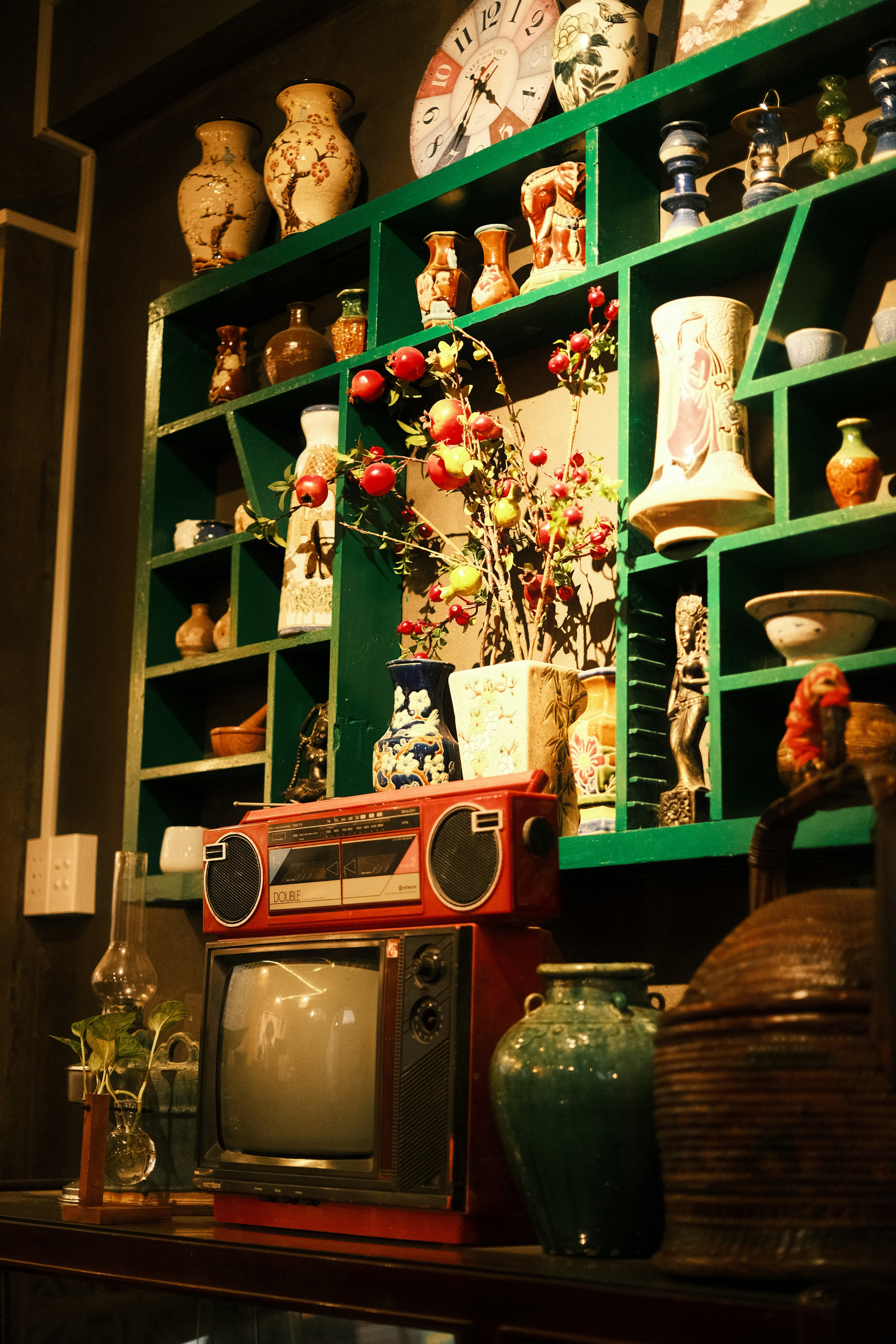 Crimson Radio Among Green Shelves: A Vintage Still-Life