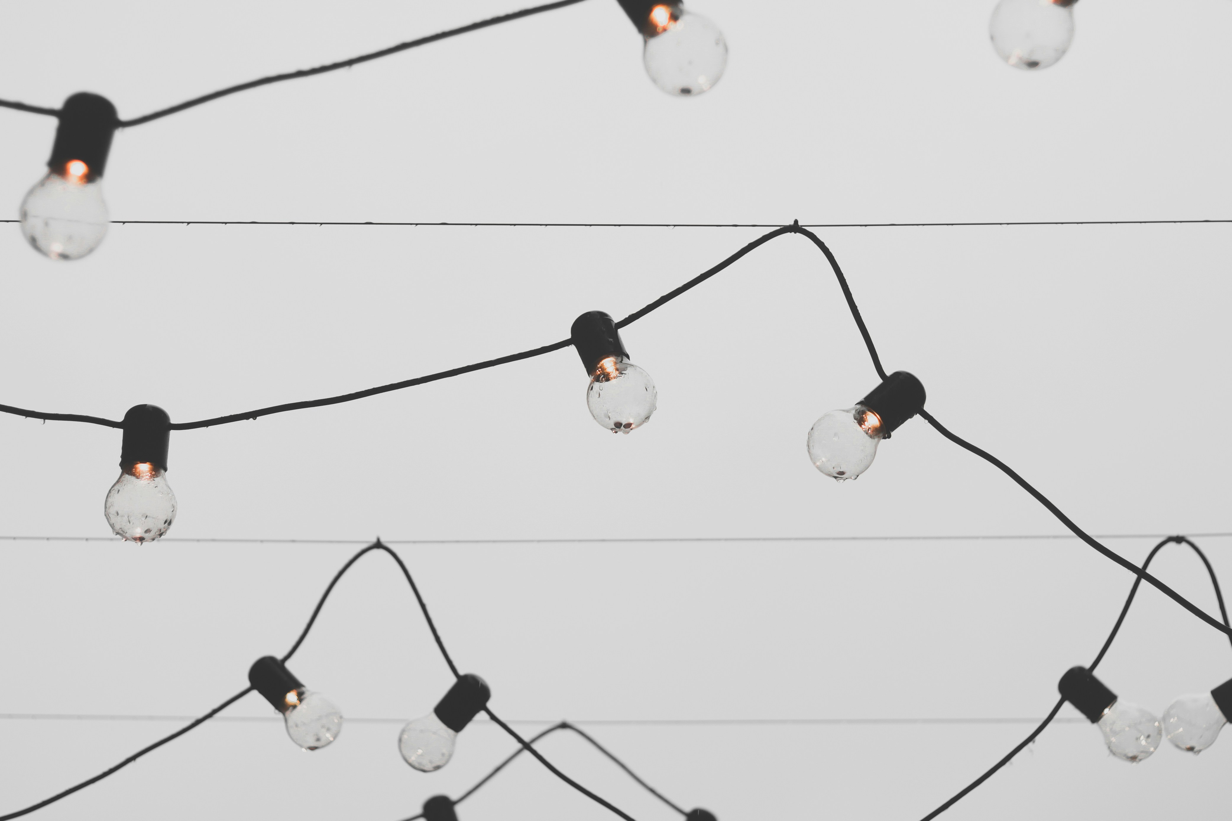a bunch of light bulbs hanging from a wire