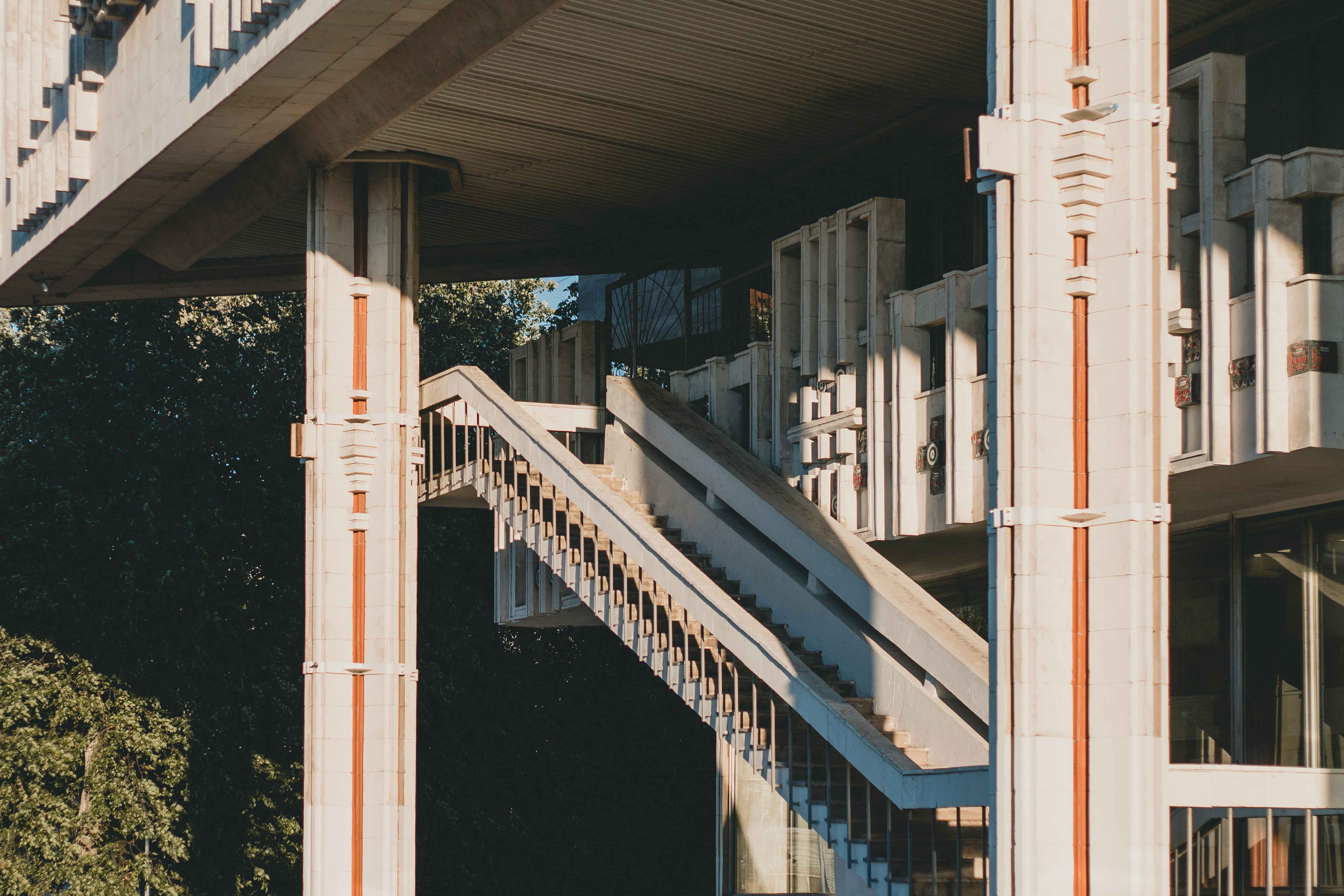 A building with a staircase going up the side of it photo – Free Soviet ...