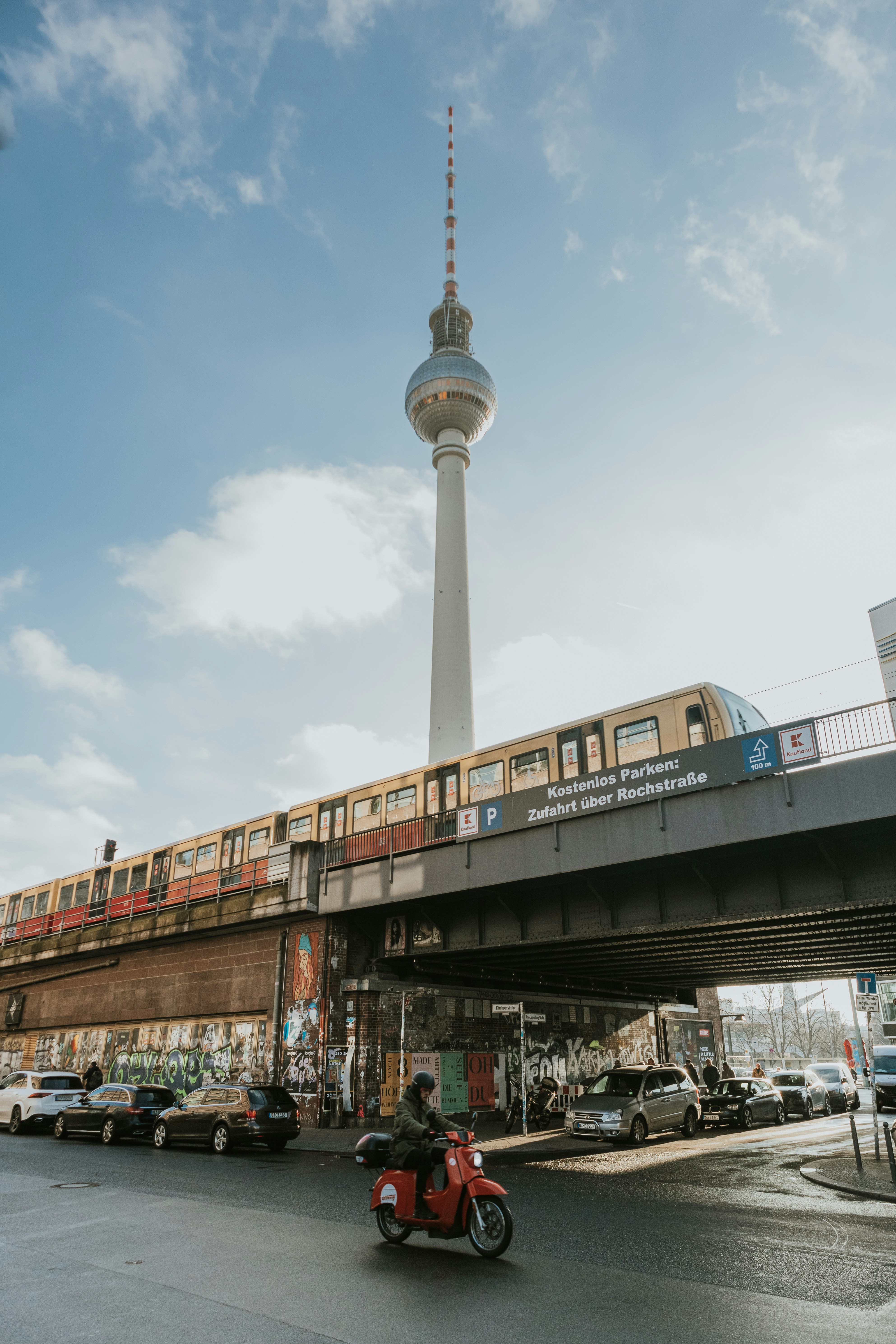 Under the Fernsehturm: Trains, Graffiti, and a Red Scooter