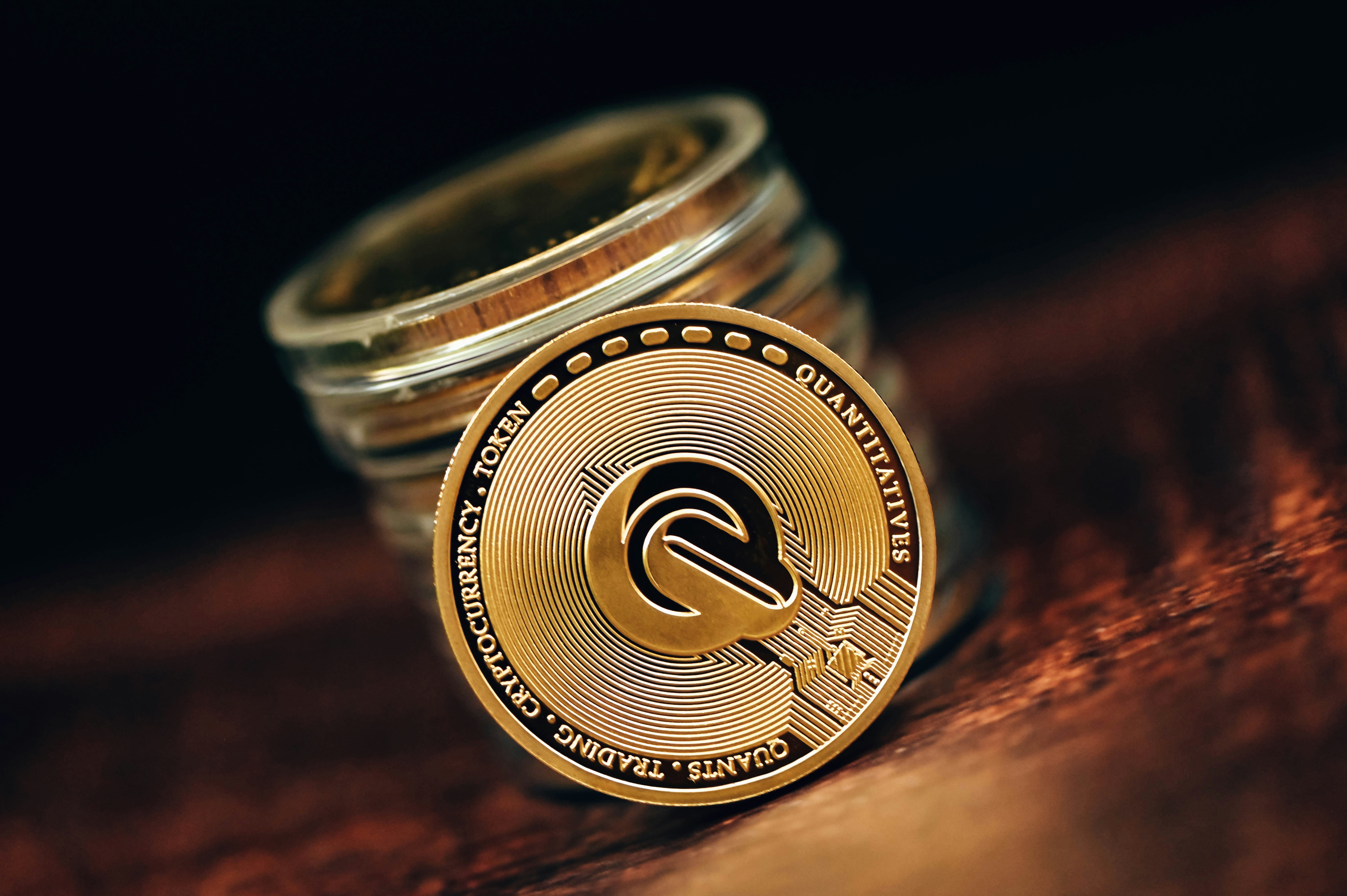 A stack of coins sitting on top of a wooden table photo – Free Market ...