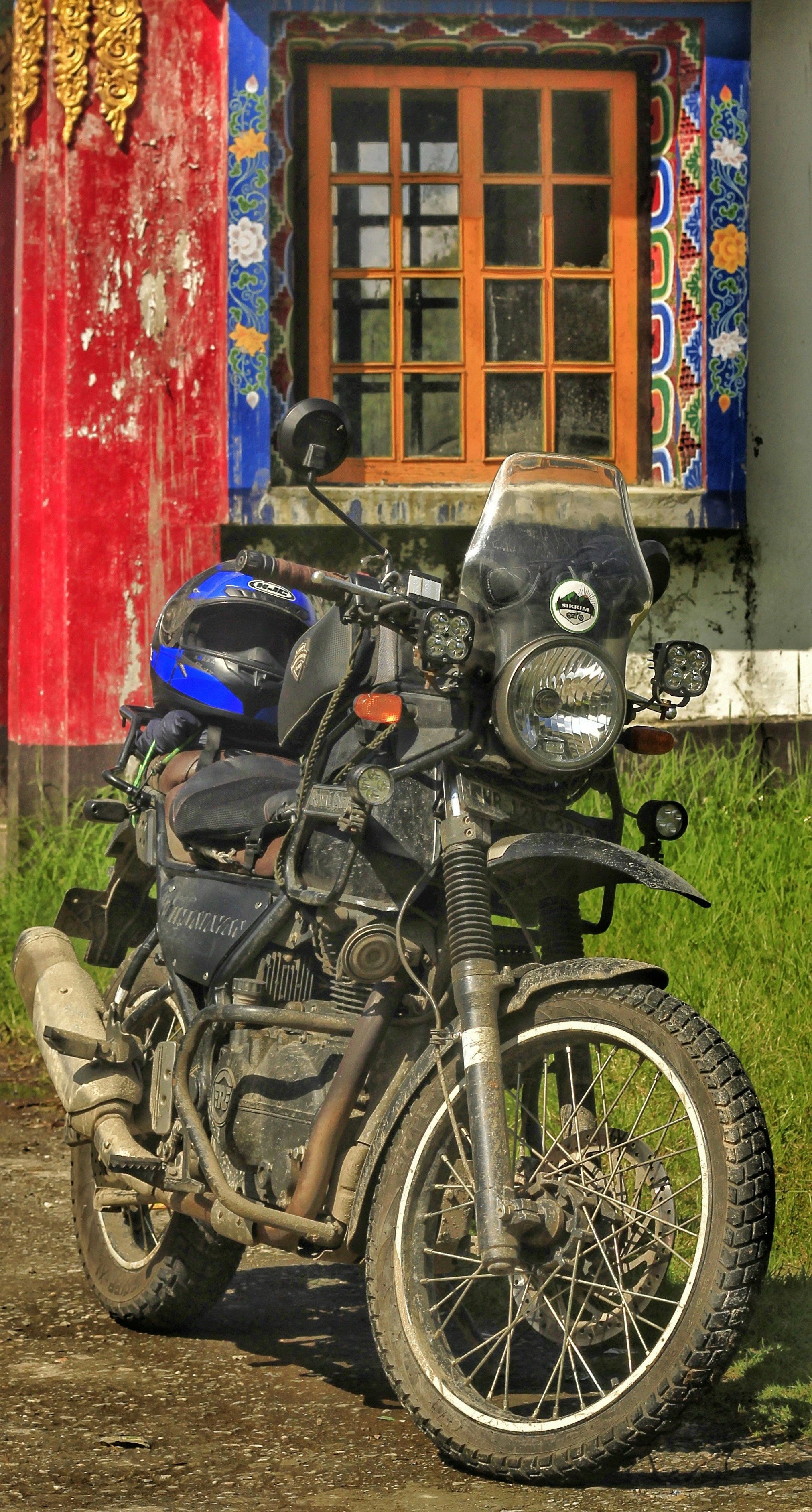 a motorcycle parked in front of a colorful building