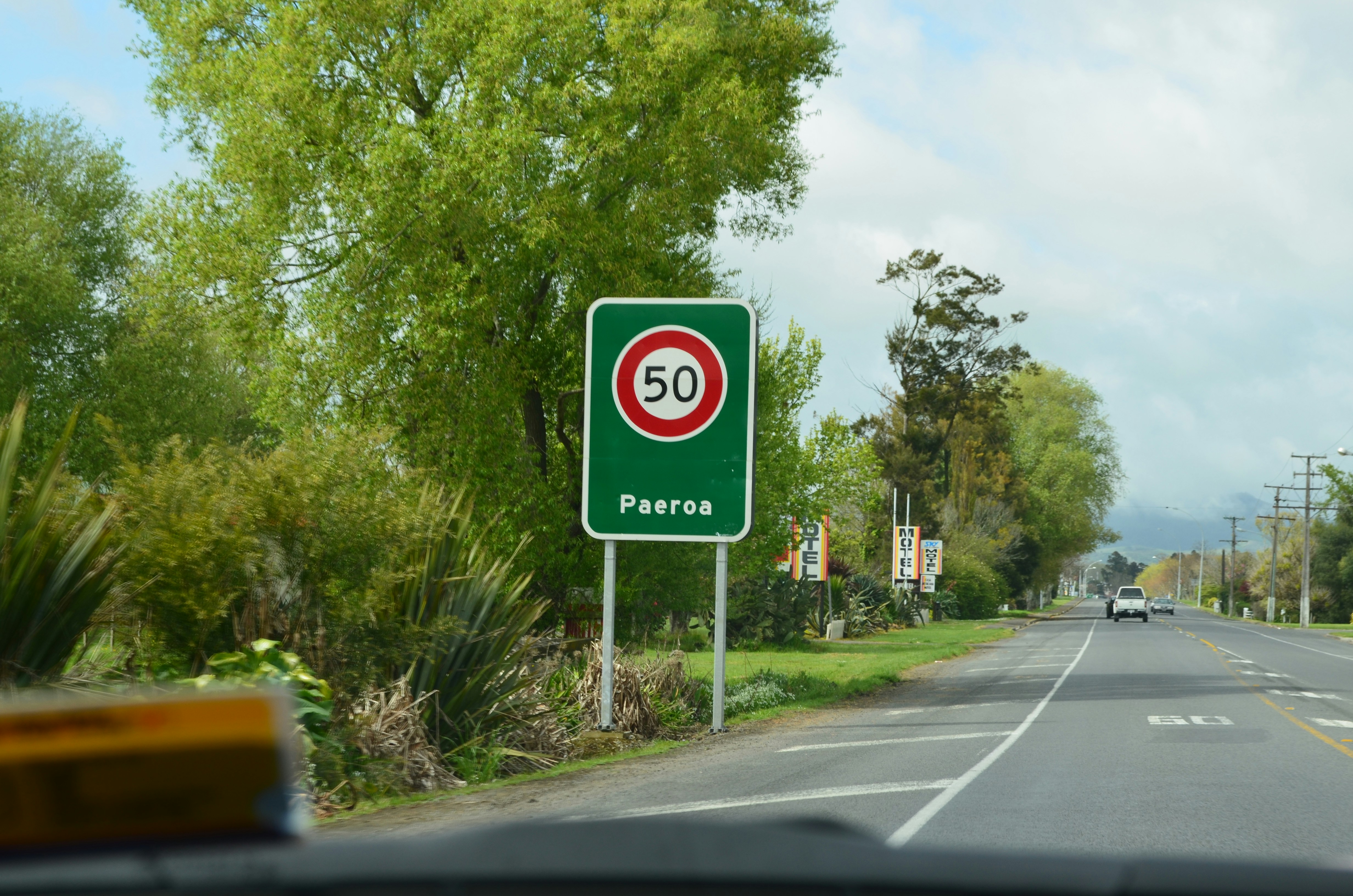a street sign on the side of a road