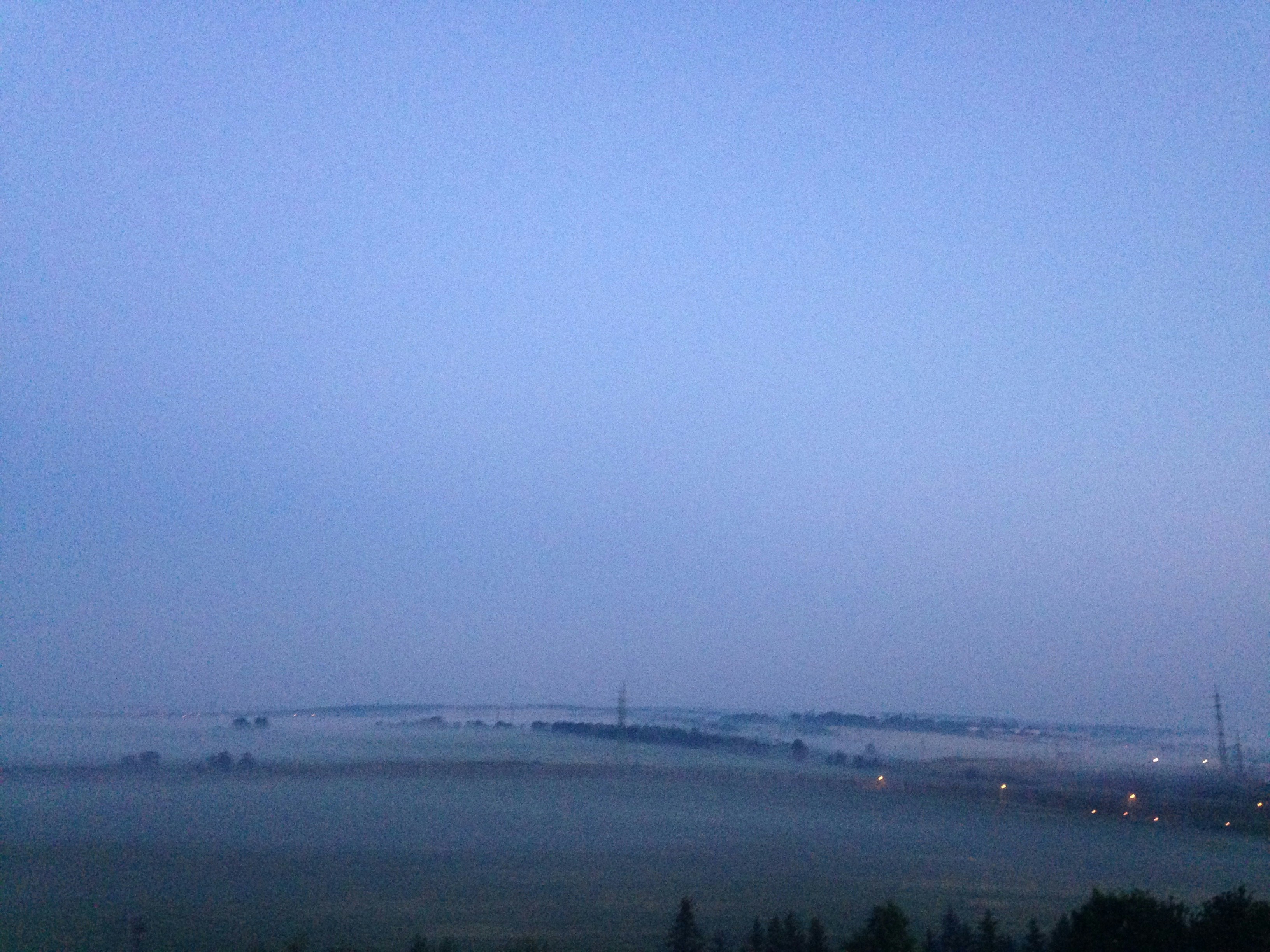 A foggy landscape with a bridge in the distance photo – Free Fog Image ...