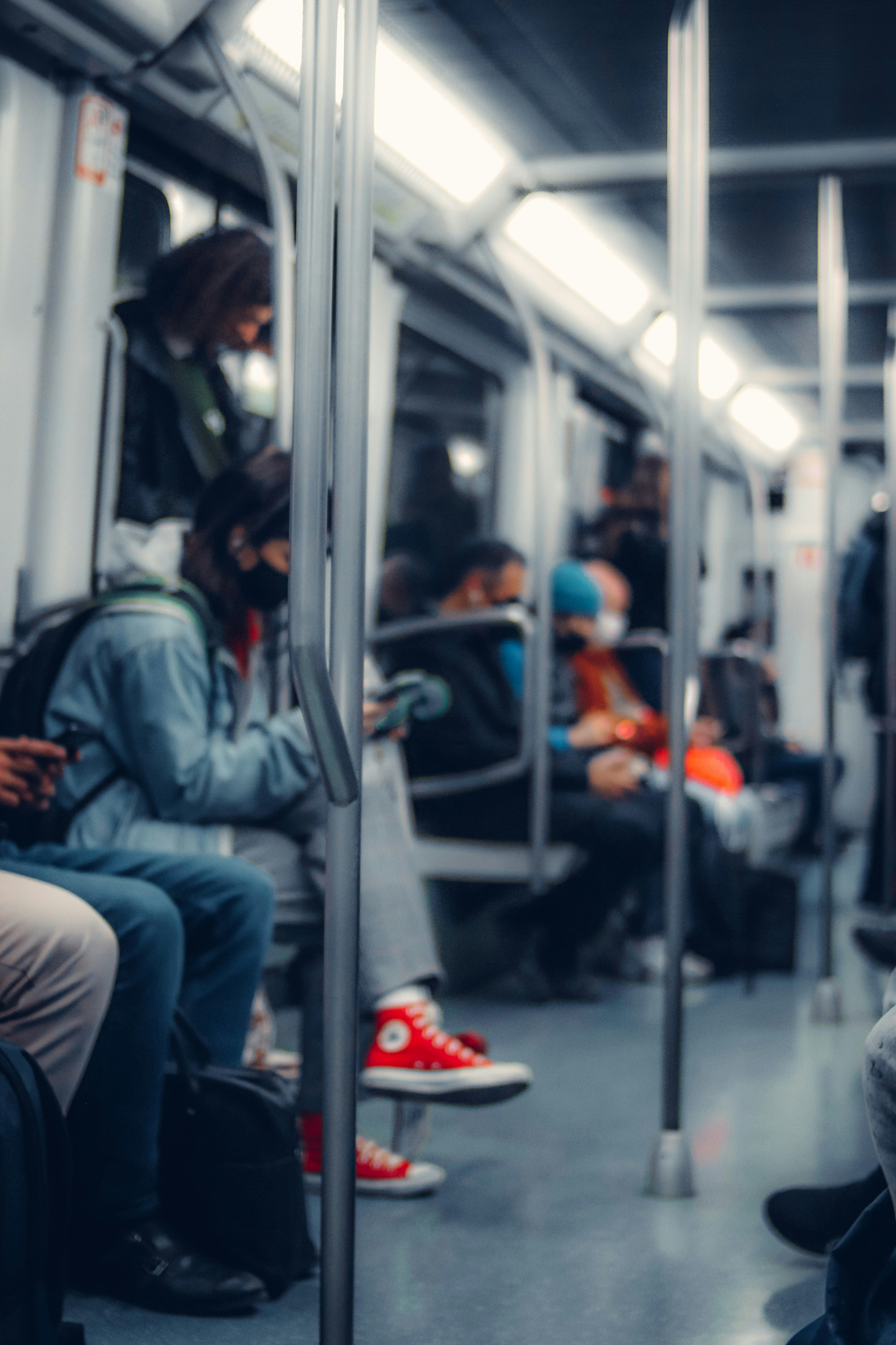 A group of people sitting on a subway train photo – Free Apparel Image ...