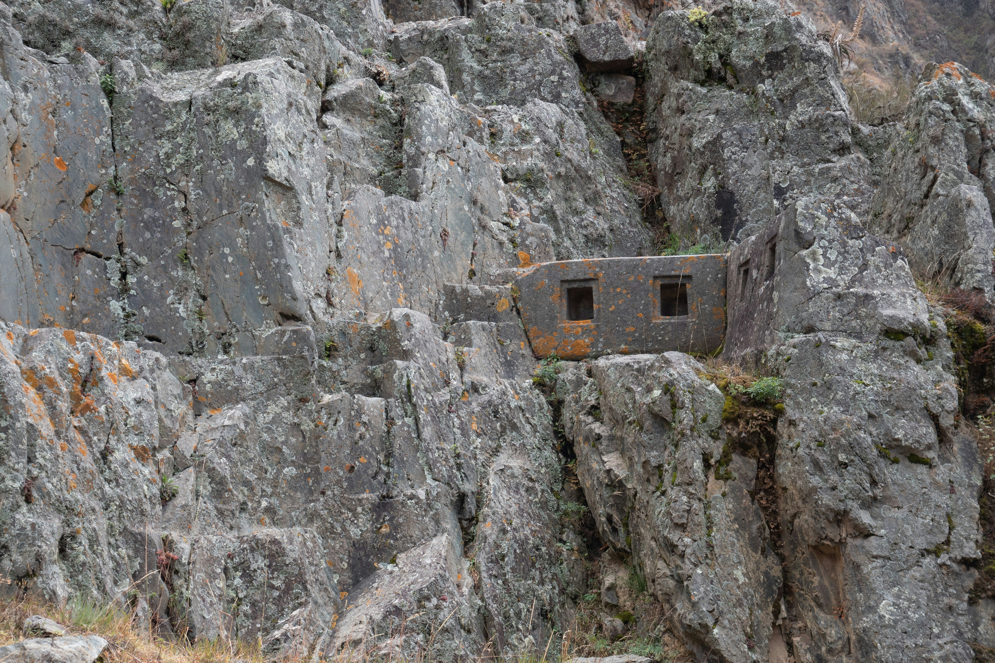 a small building built into the side of a mountain