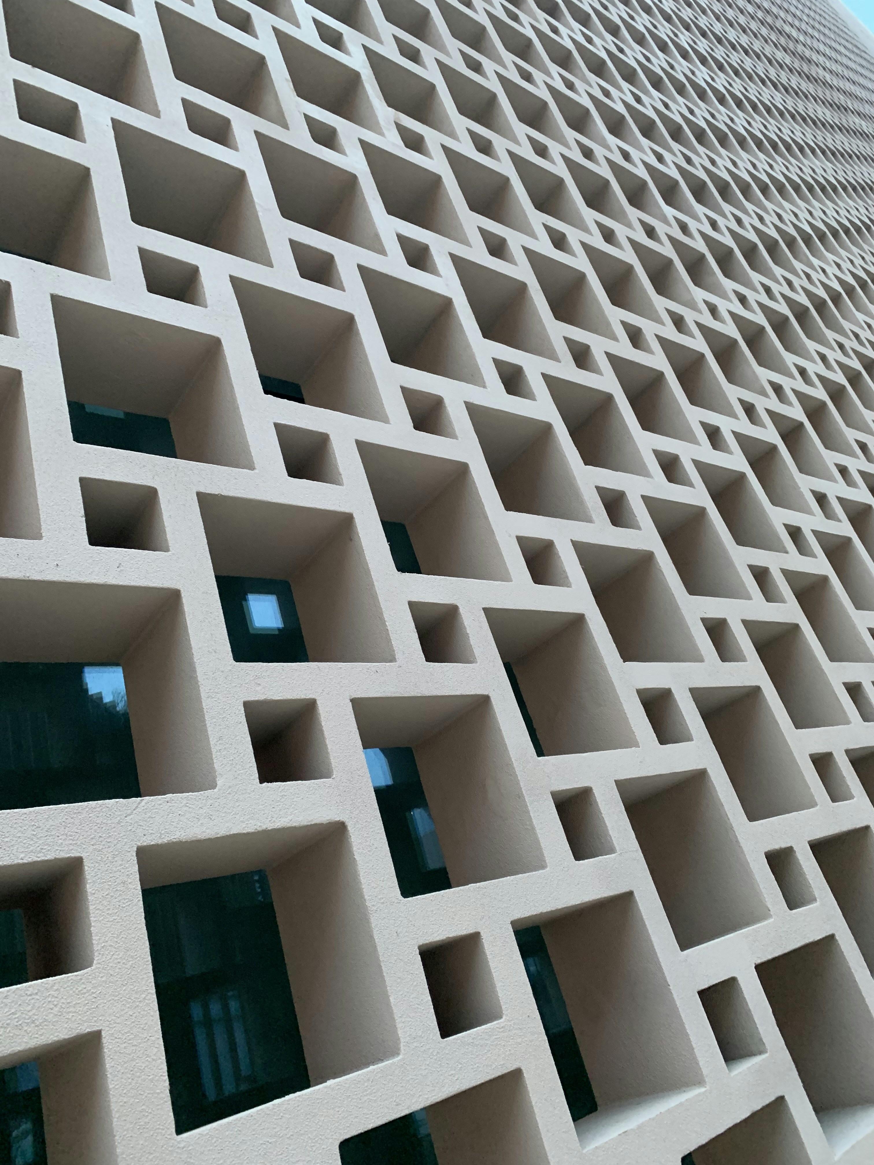 A close up of a building made of cement blocks photo – Free Minimal ...